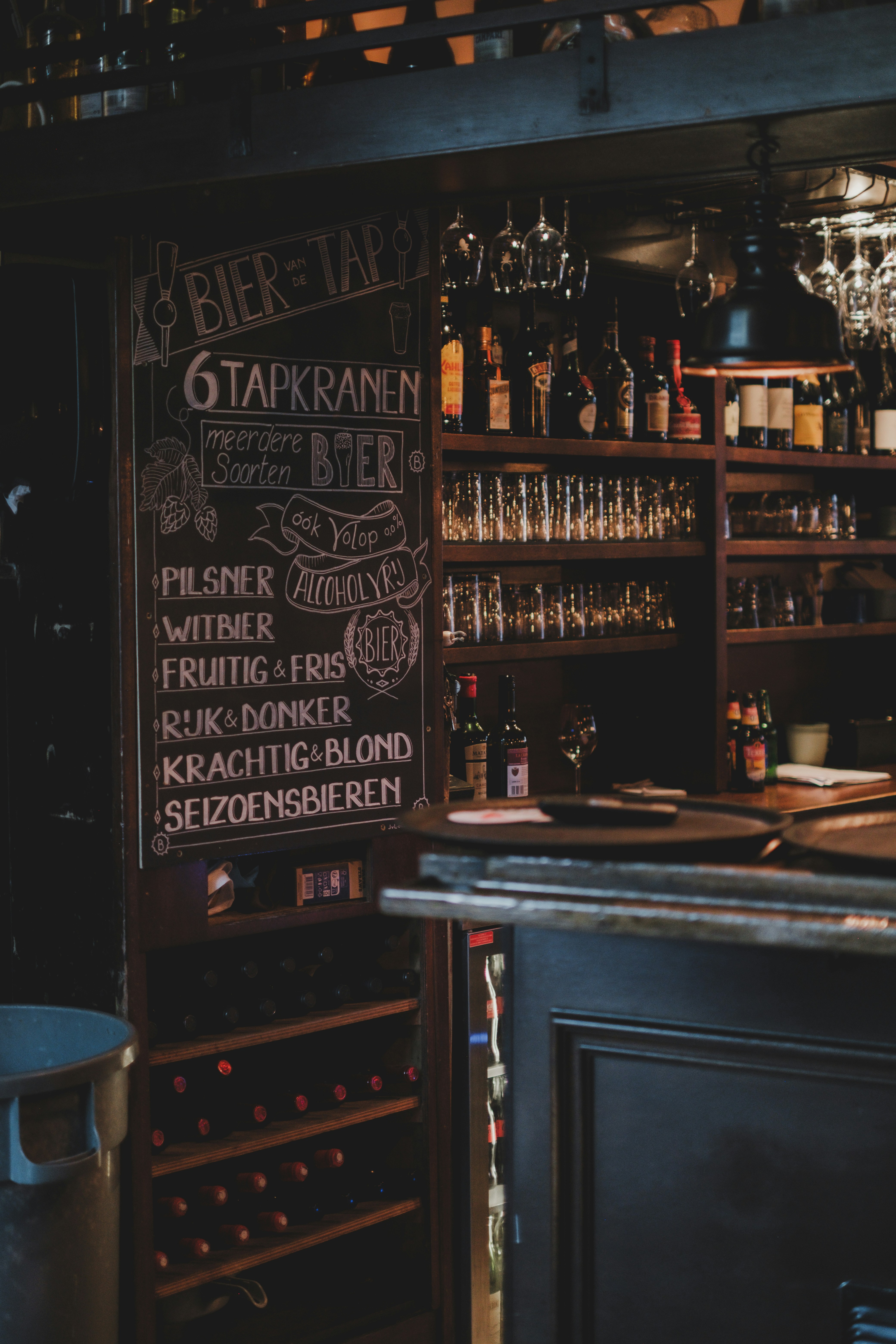 Chalkboard Menu Framed by Dim Bar Shelves