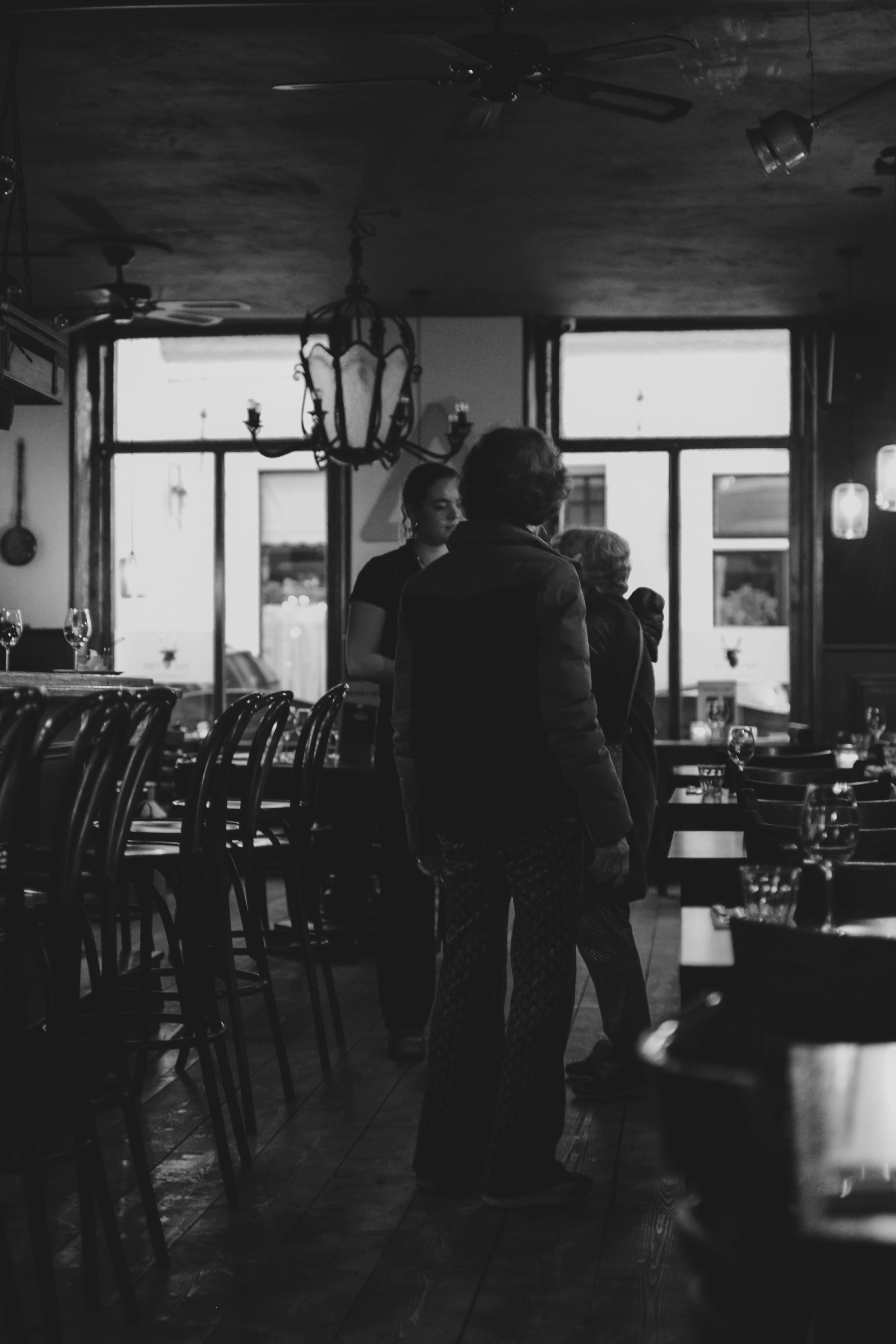 Silent Exchange in a Dimly Lit Bistro