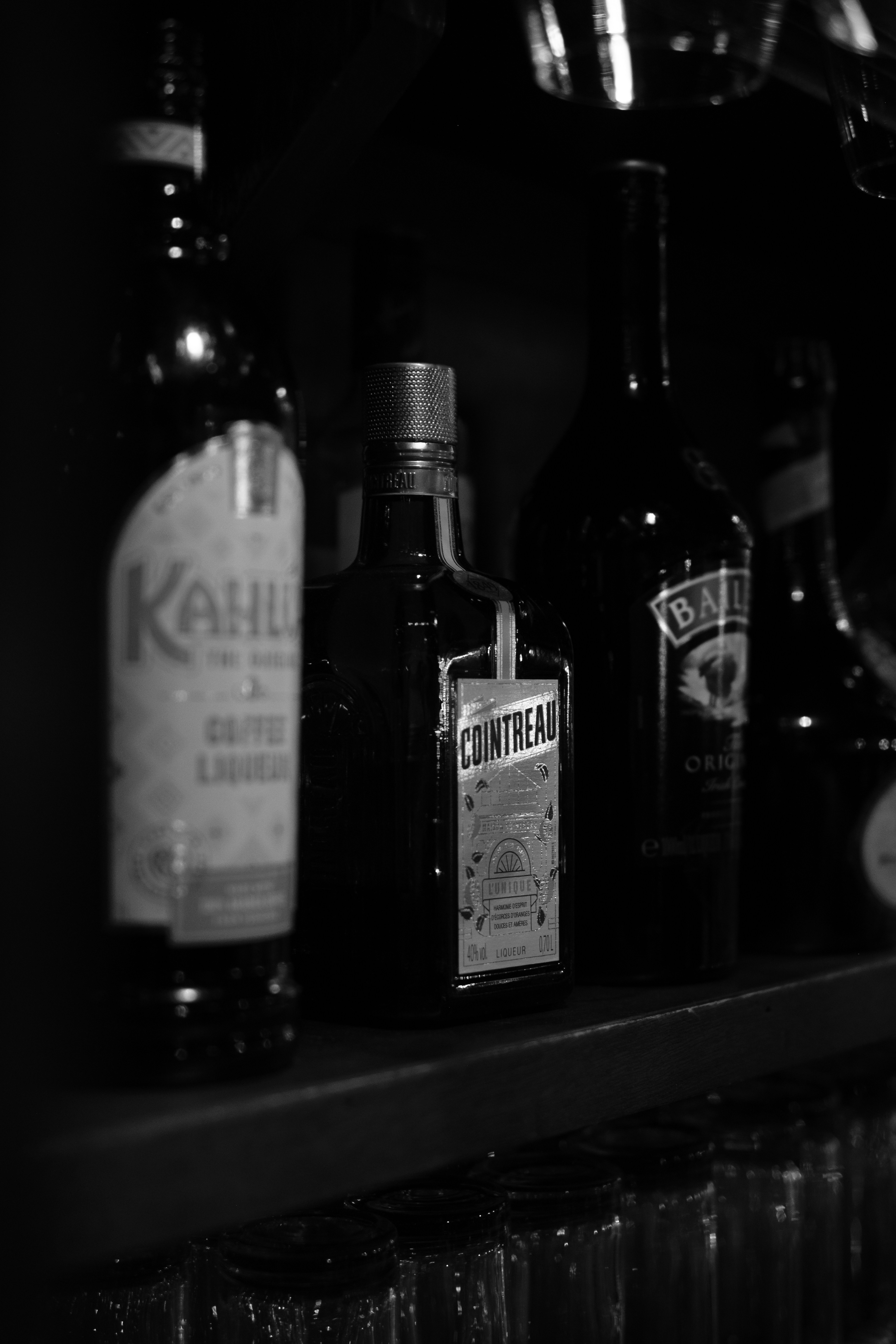Midnight Shelf: A Quiet Study of Bottles in Mono
