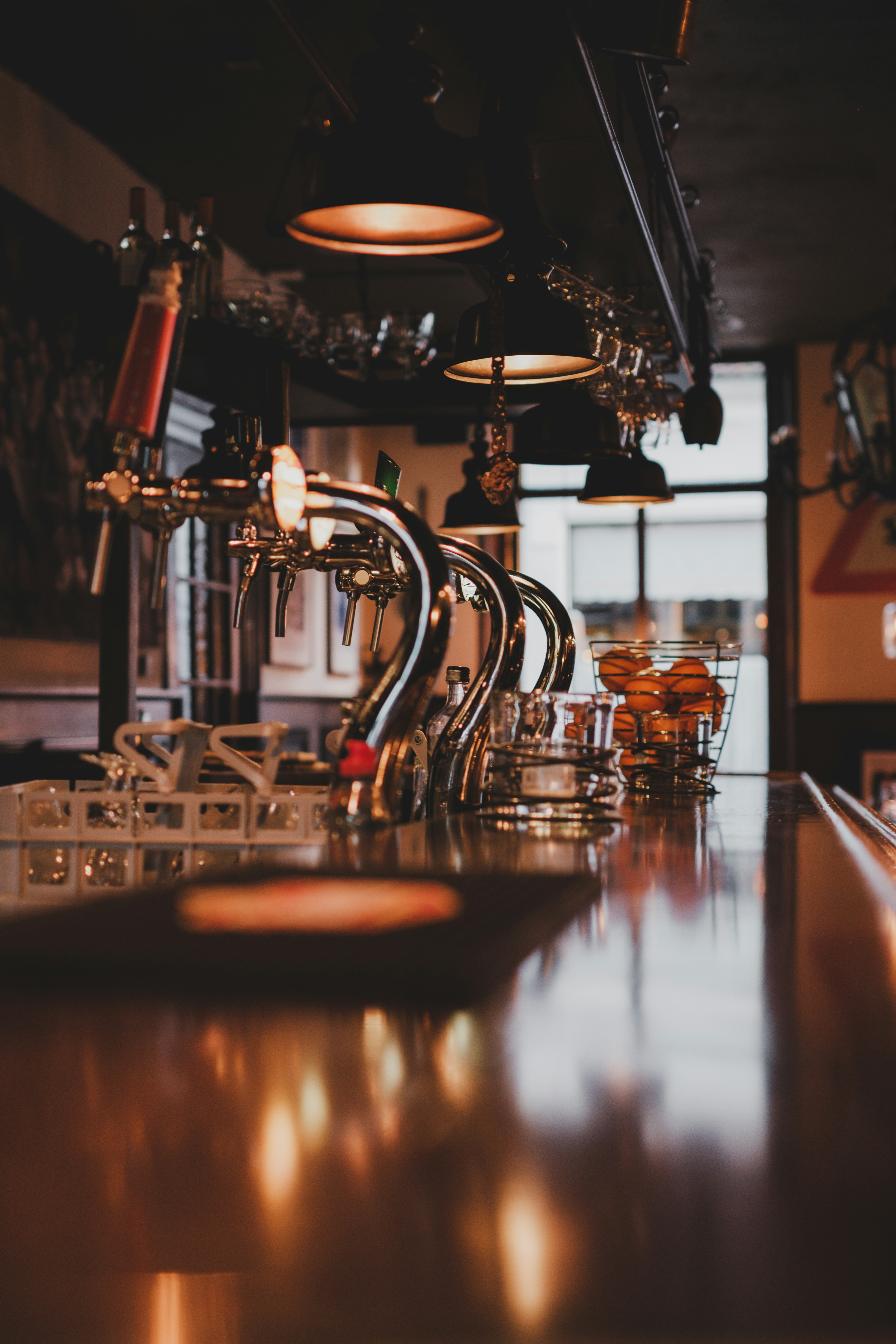 Polished Tap Handles in a Quiet Bar
