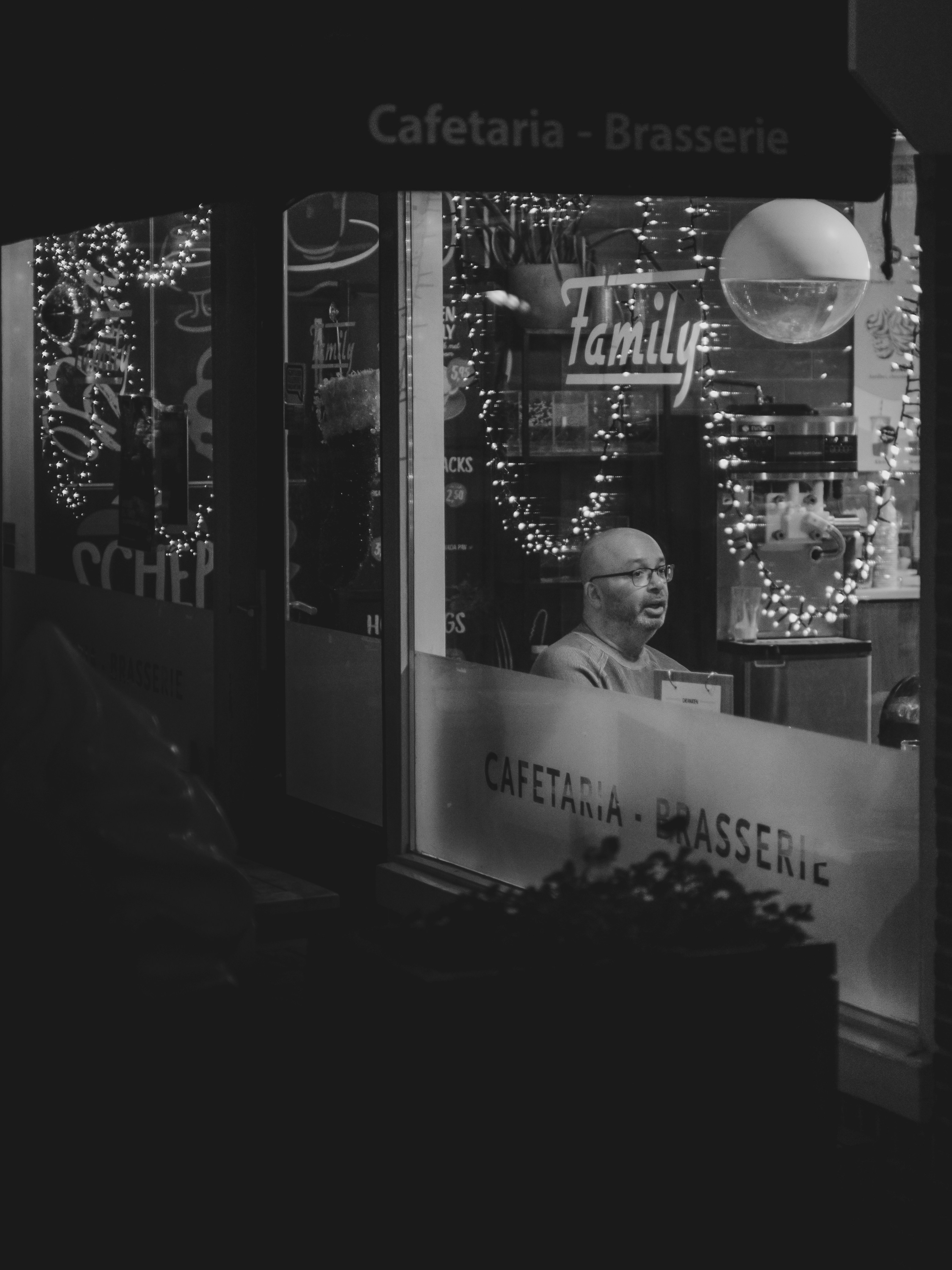 Quiet Watcher Behind the Café Glass