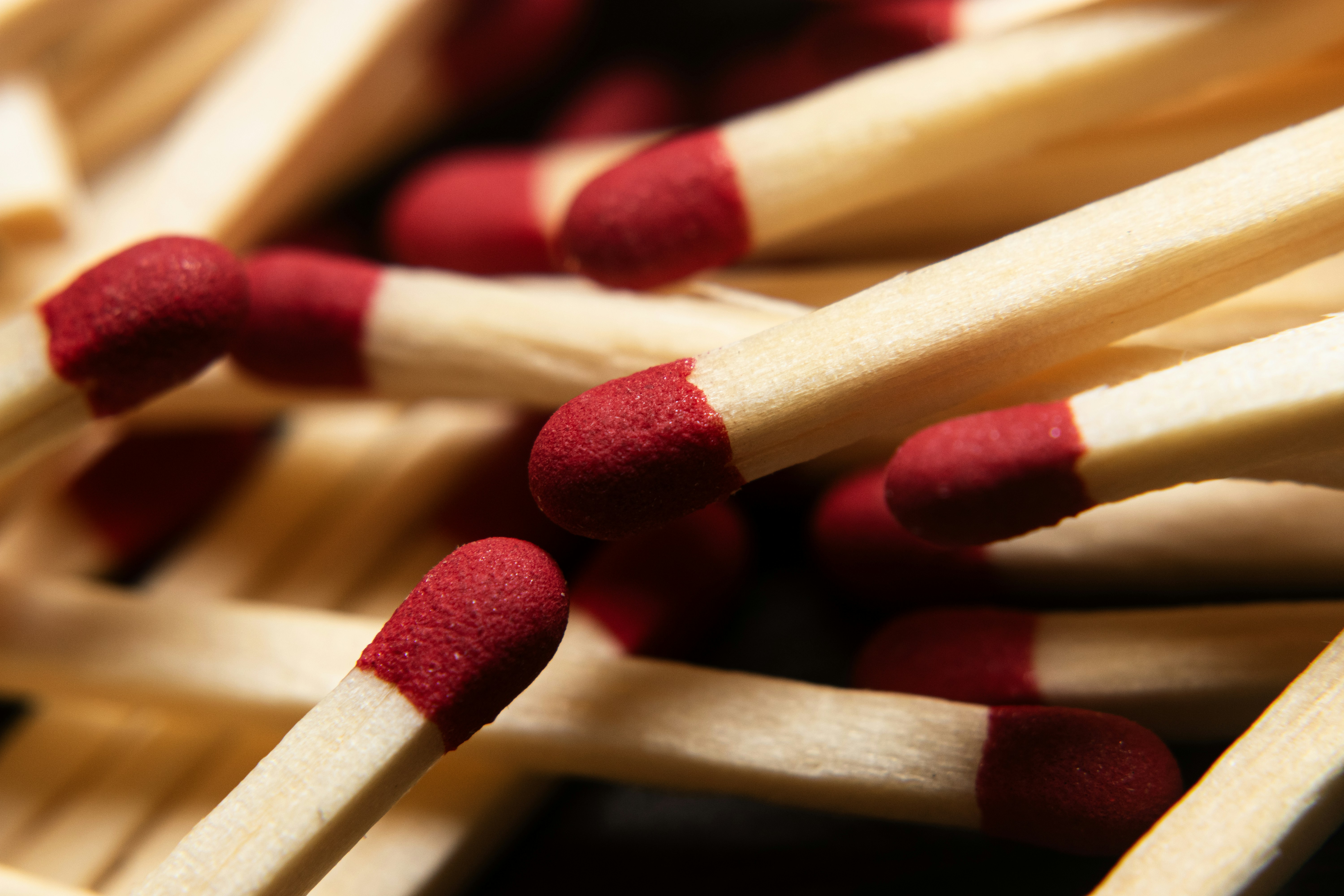 Crimson Tips: A Close-Up of Ember-Red Matches in a Tight Coil