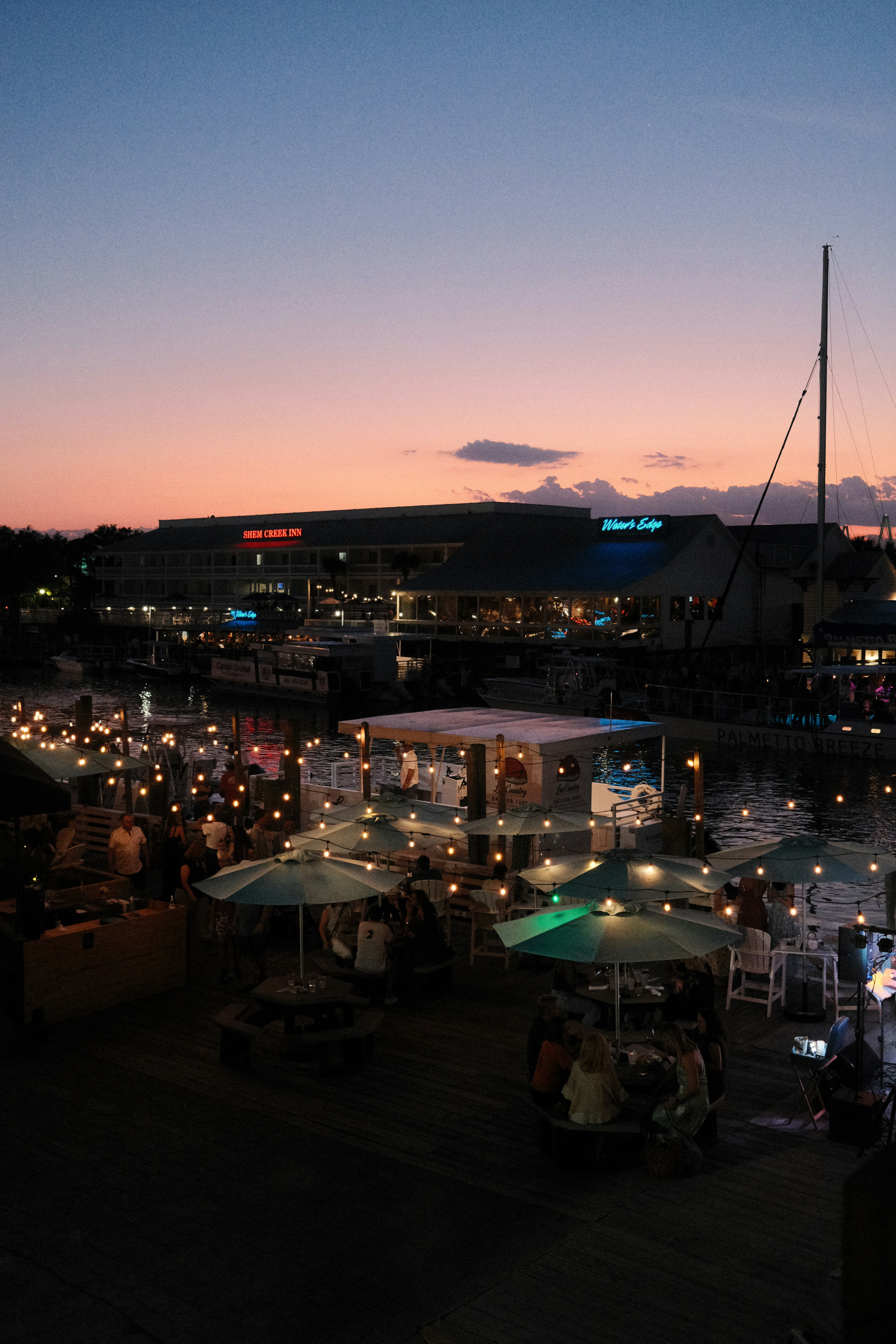 Twilight Harbor: Neon Lights and Quiet Boats at Dusk