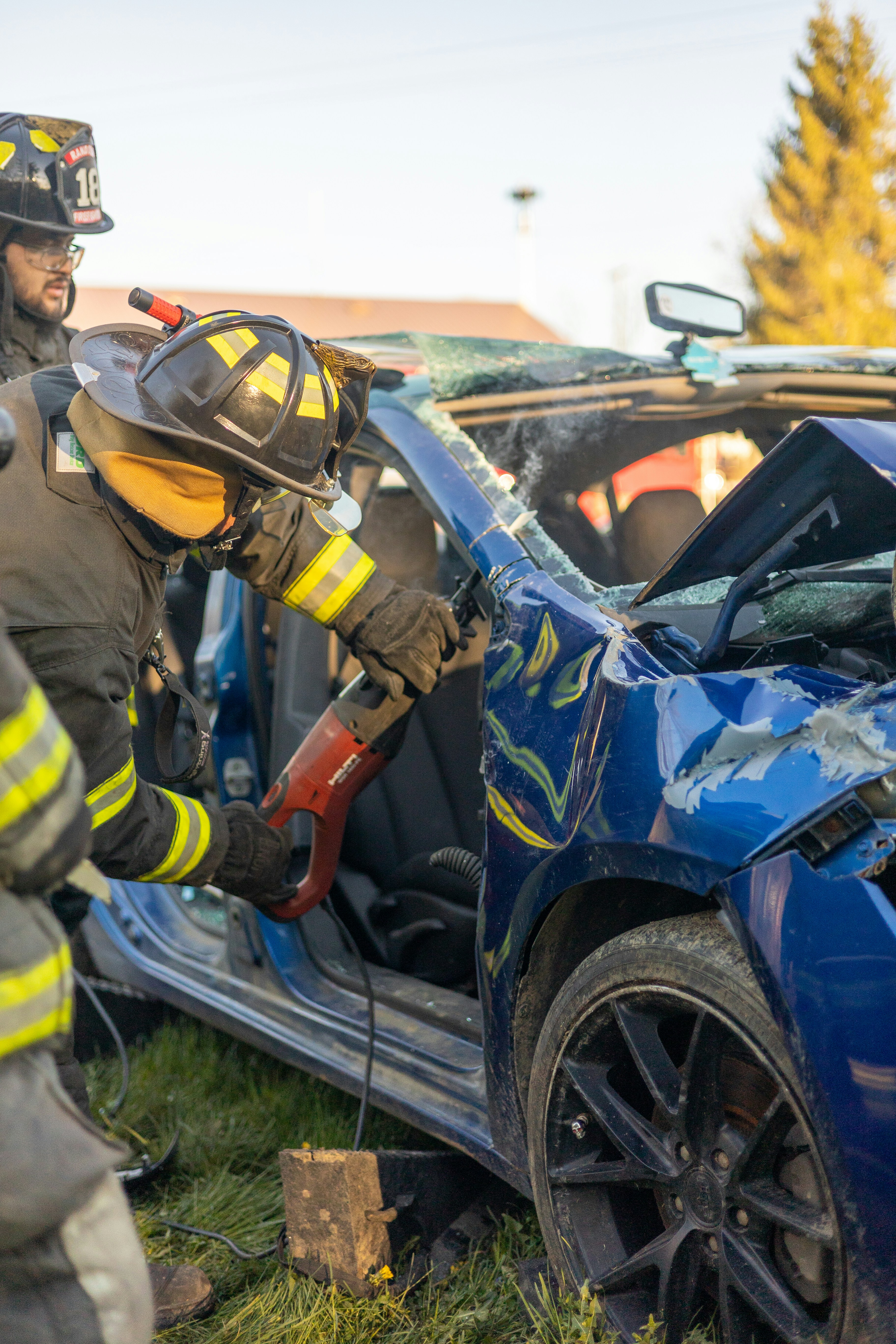 Rescue in Blue: Firefighter pries open a wrecked sedan