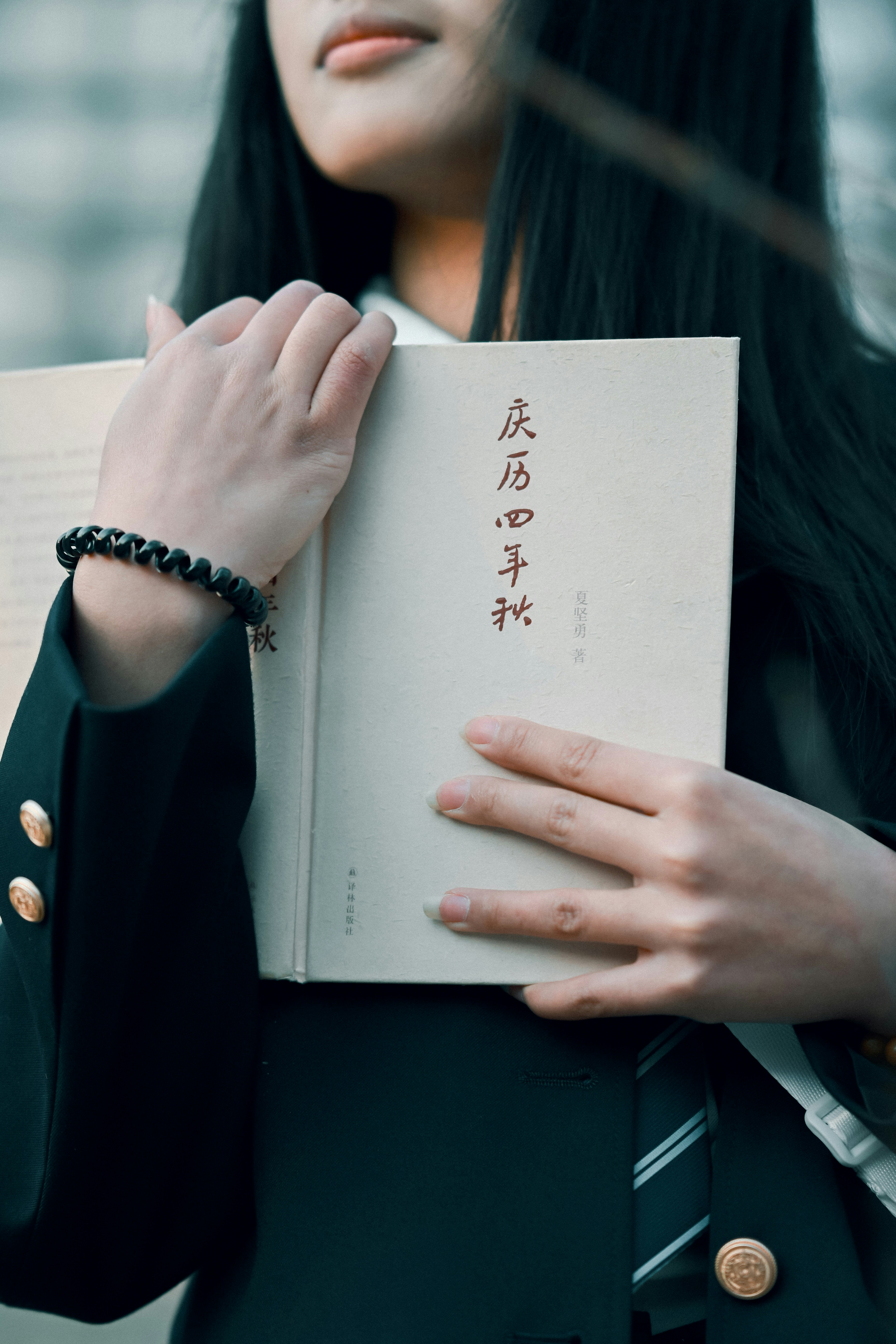 Quiet Moment with a Journal: Subtle Confidence in a School-Uniform Portrait