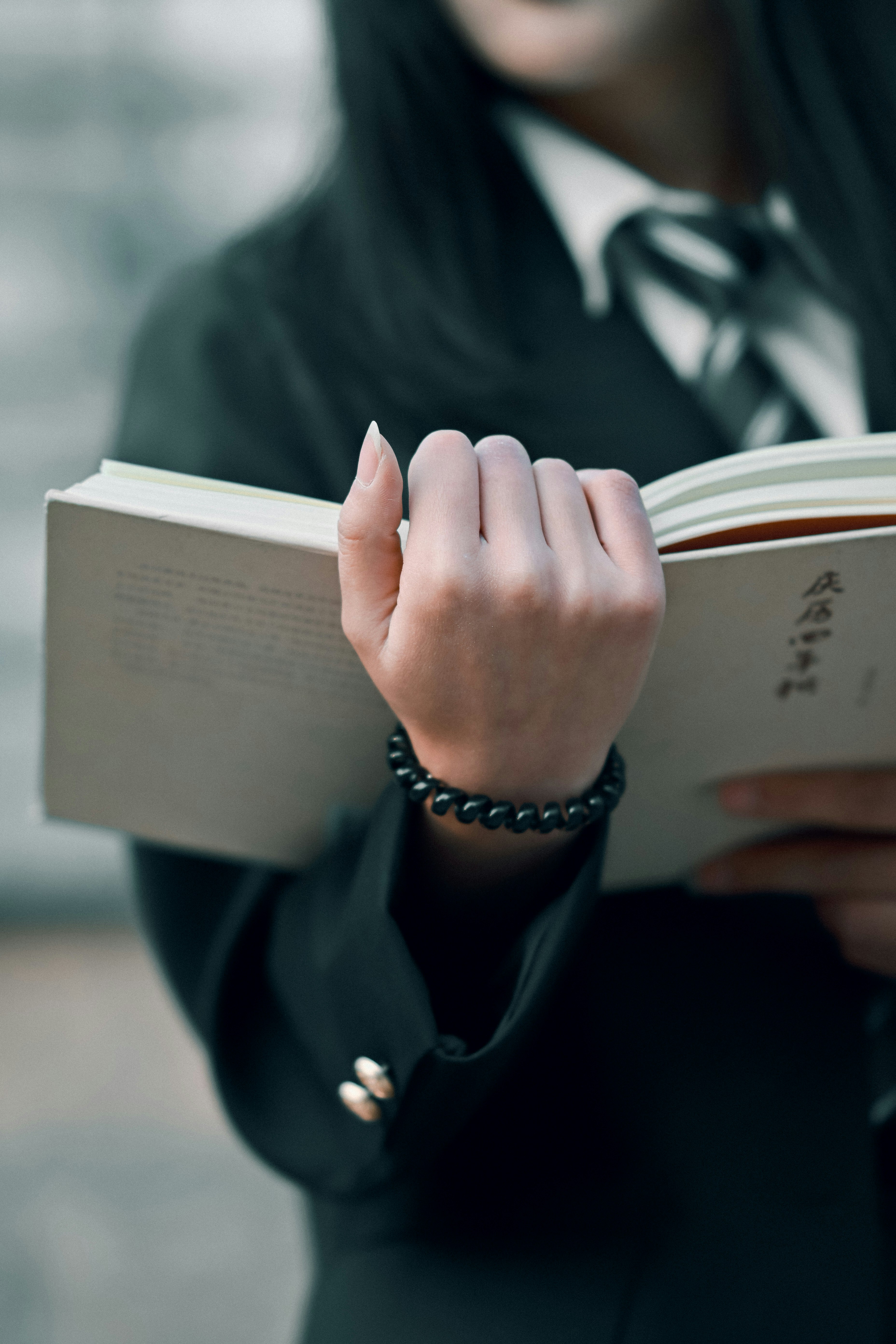 Open Book, Quiet Study: A Gentle Focus on a Reader's Hands