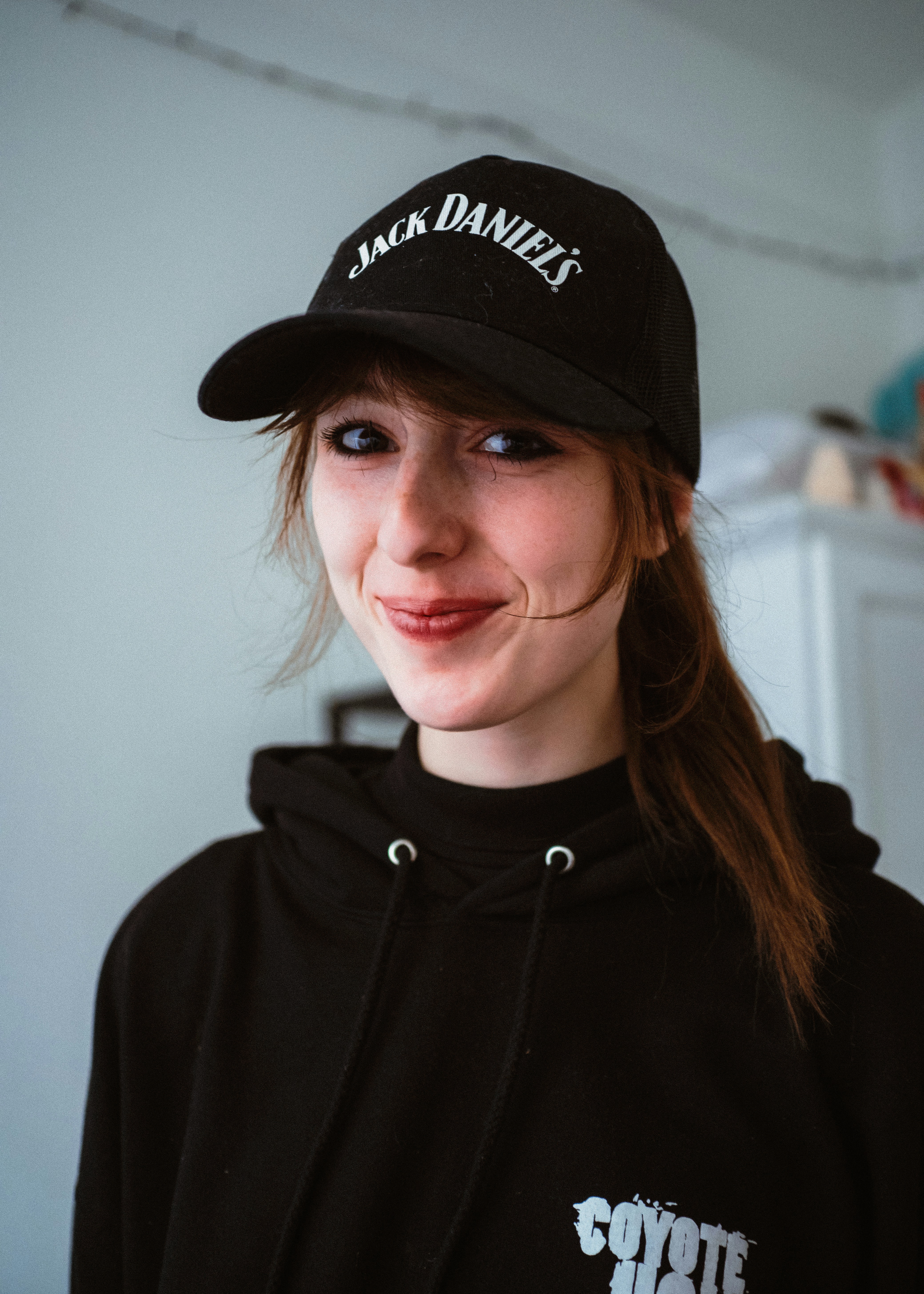 Cap and Confidence: A Casual Smile in Soft Morning Light
