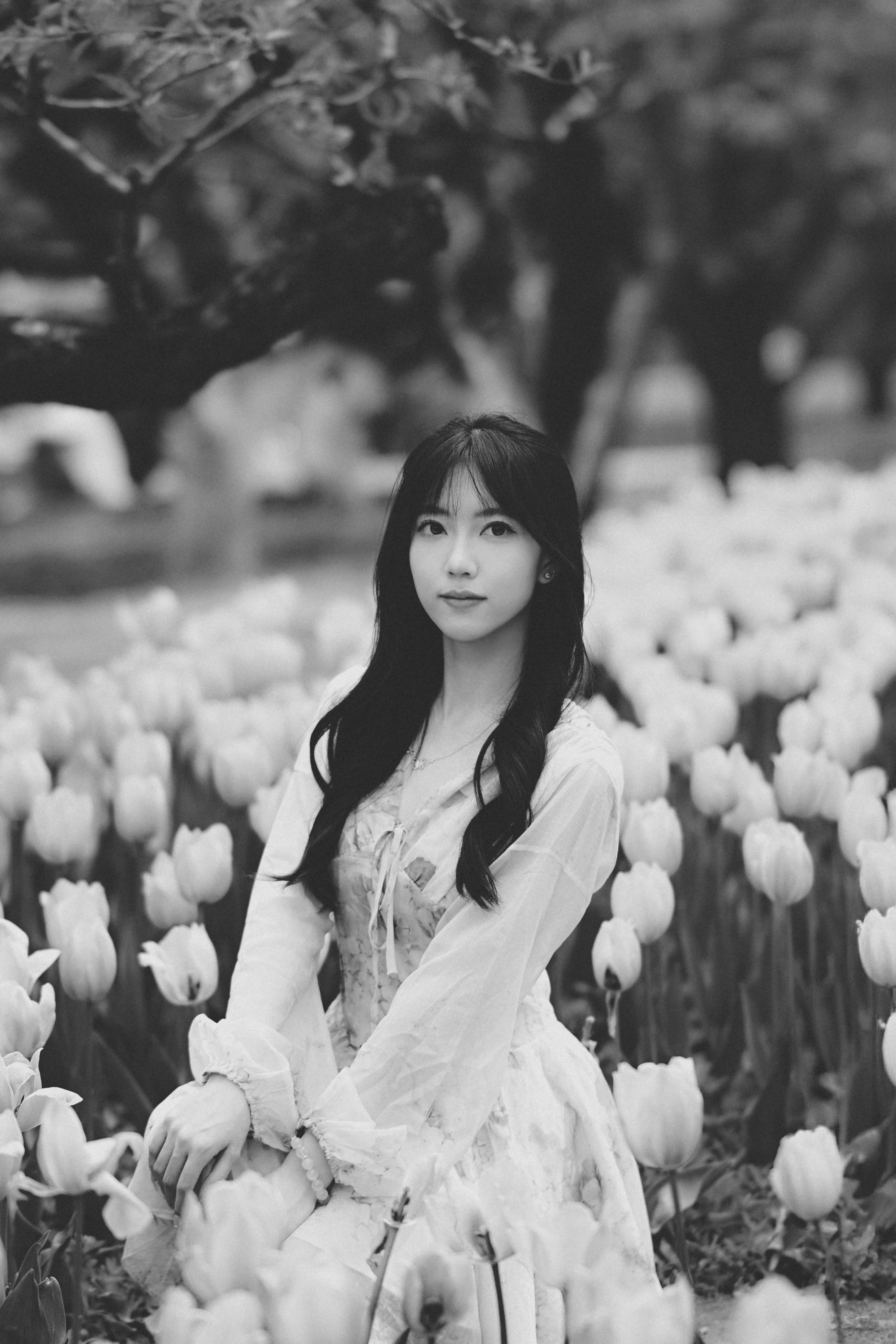 Portrait among Tulips: Quiet Elegance in Monochrome