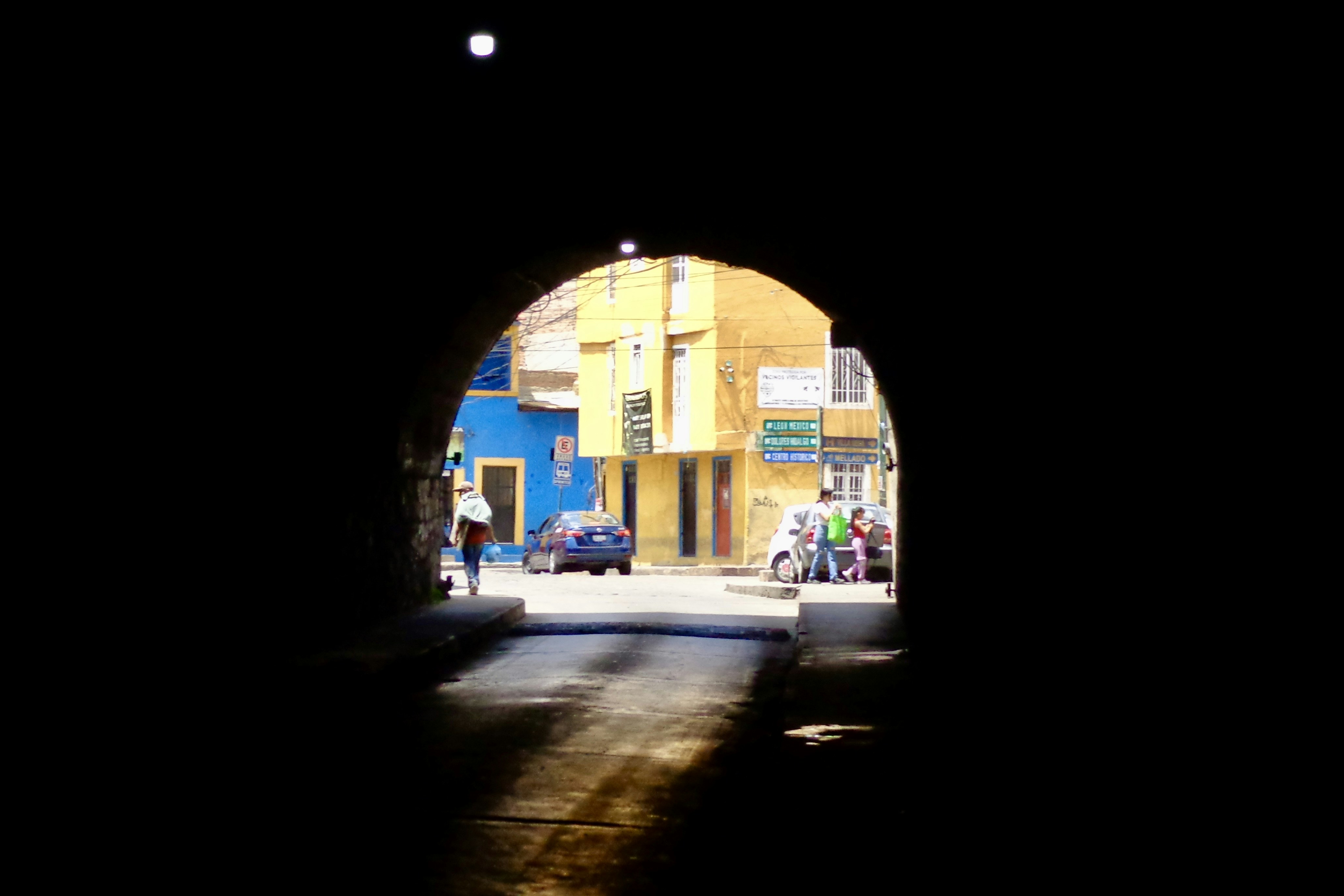 Emerging Street Scene at the Tunnel's End