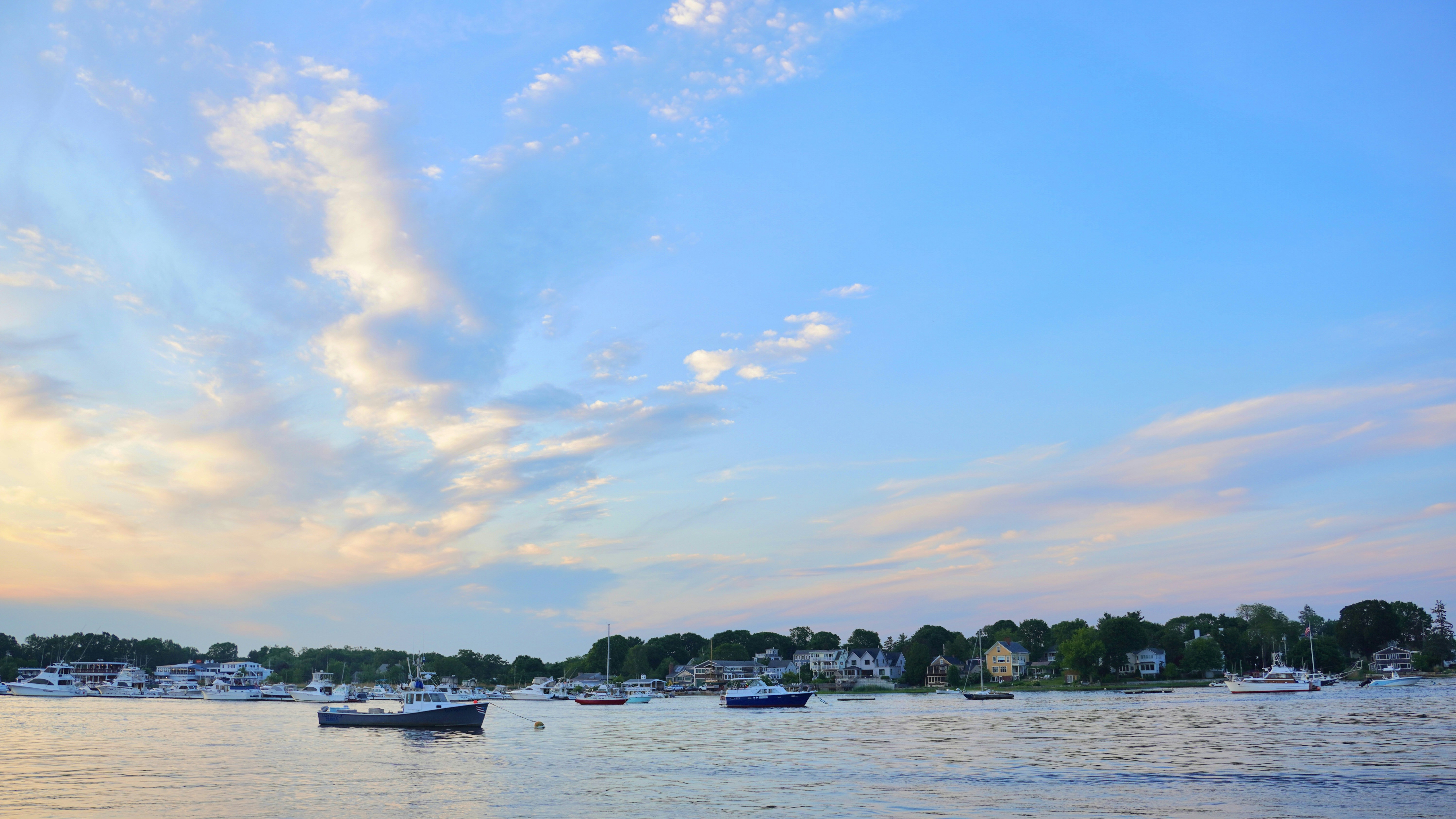 Harbor Sunset: Boats Silhouetted Along the Quiet Marina
