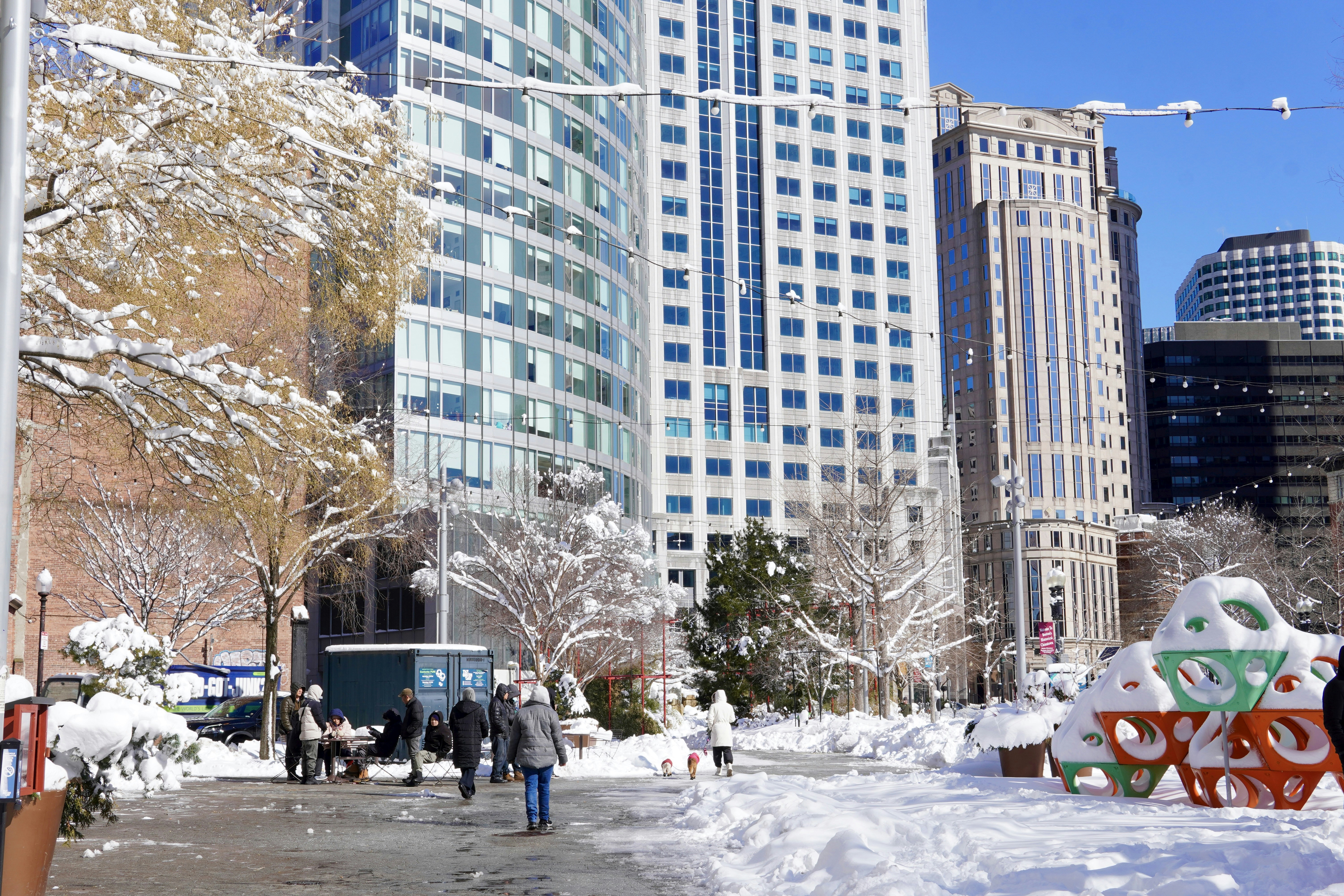 Snowy City Plaza: People, Skyscrapers, and Arctic Playground