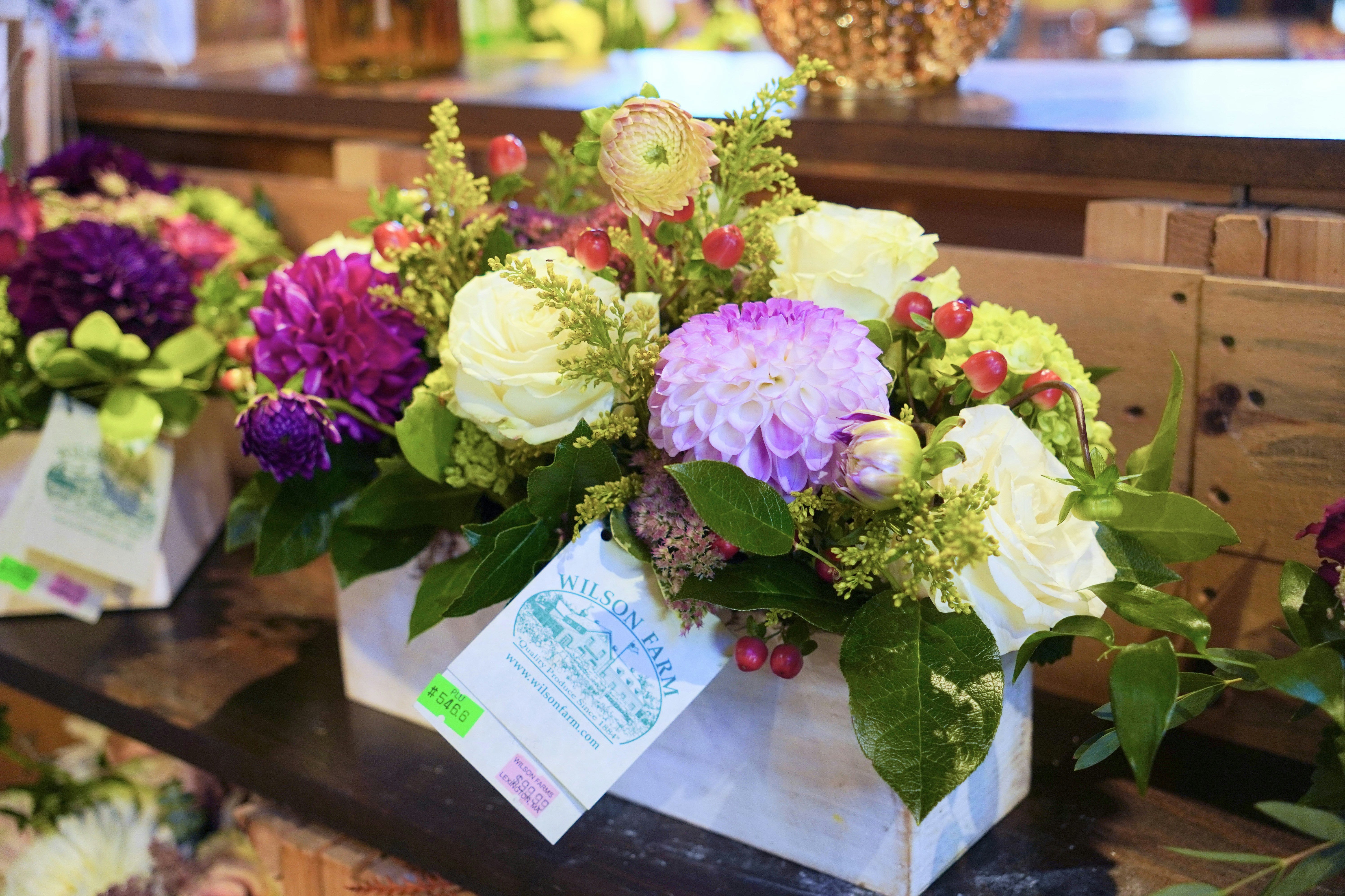 Bouquet Display with White, Pink, and Purple Florals in Wooden Market Stand