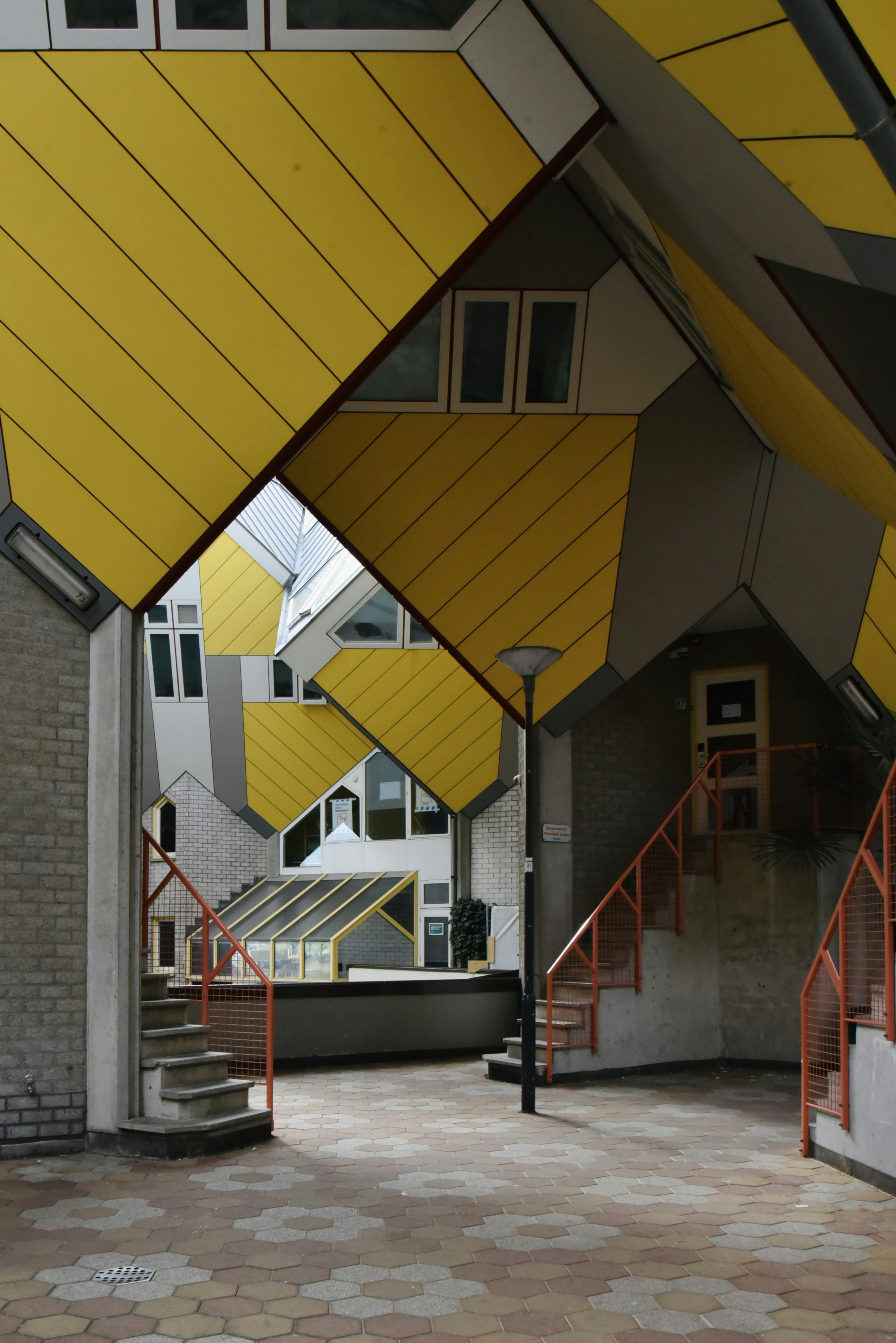 Yellow Angles: A Corridor of Angled Facades