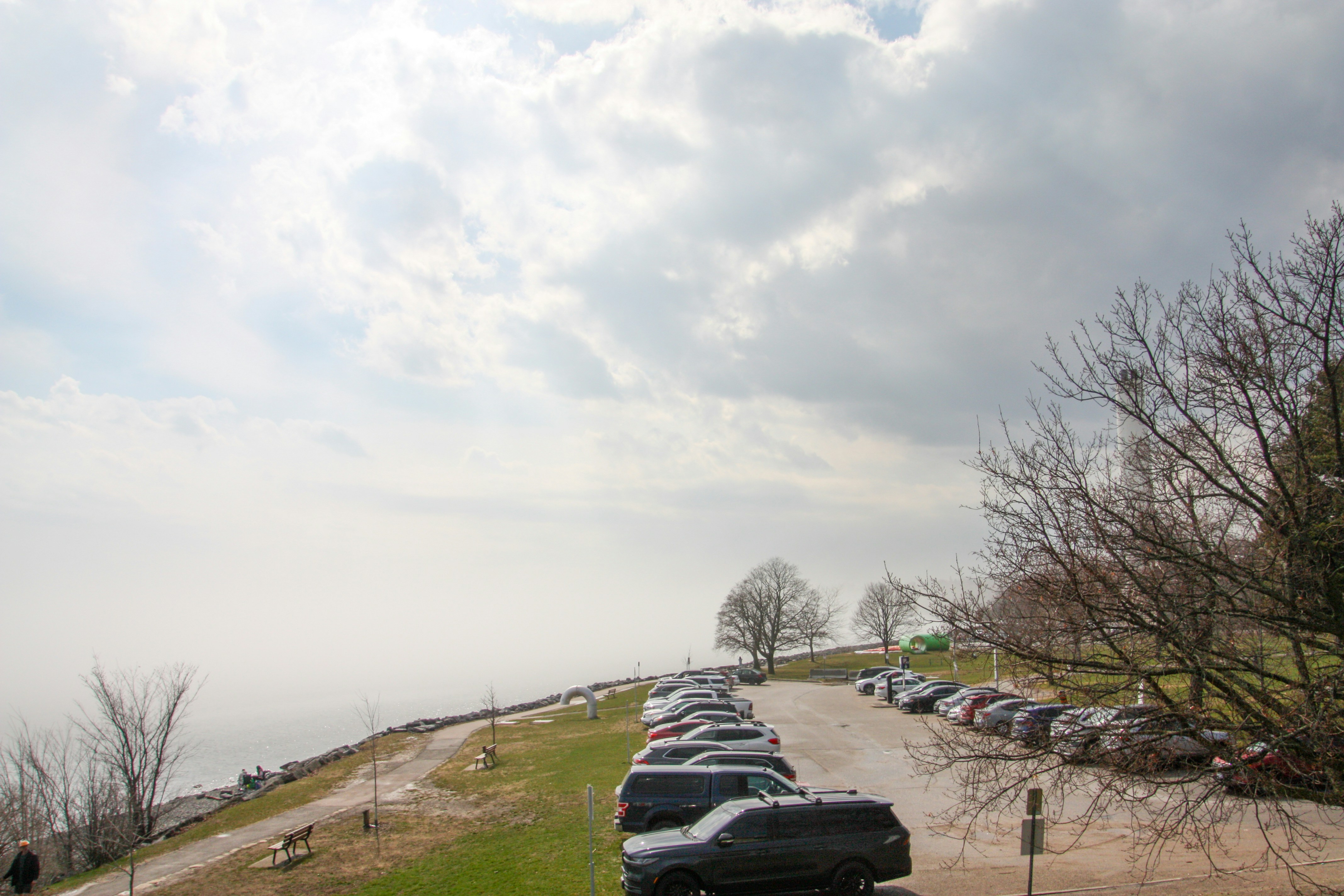 Coastal Parking Aisle: Line of Cars by the Cliff