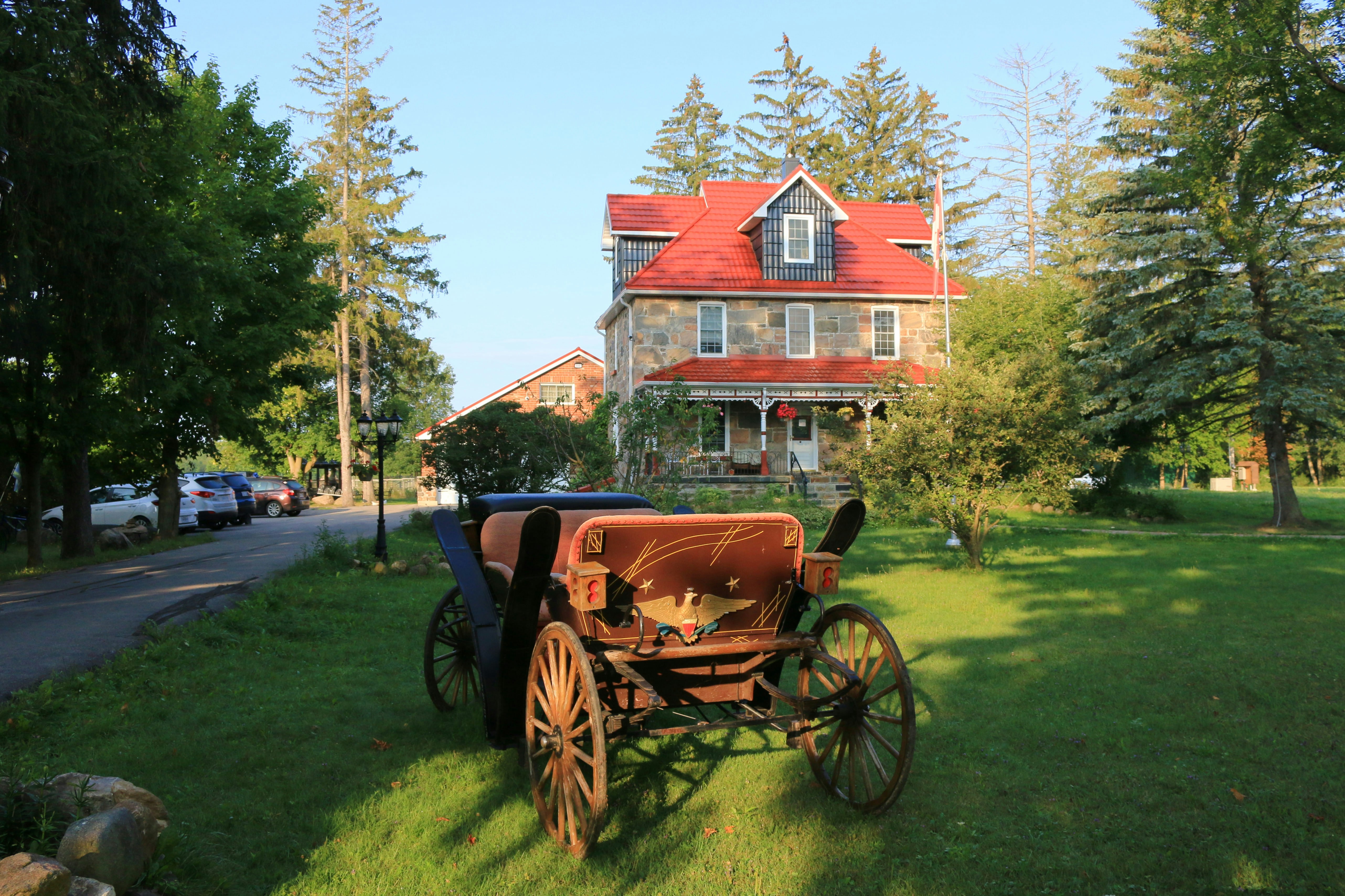 Sunlit Carriage Forward to a Vintage House