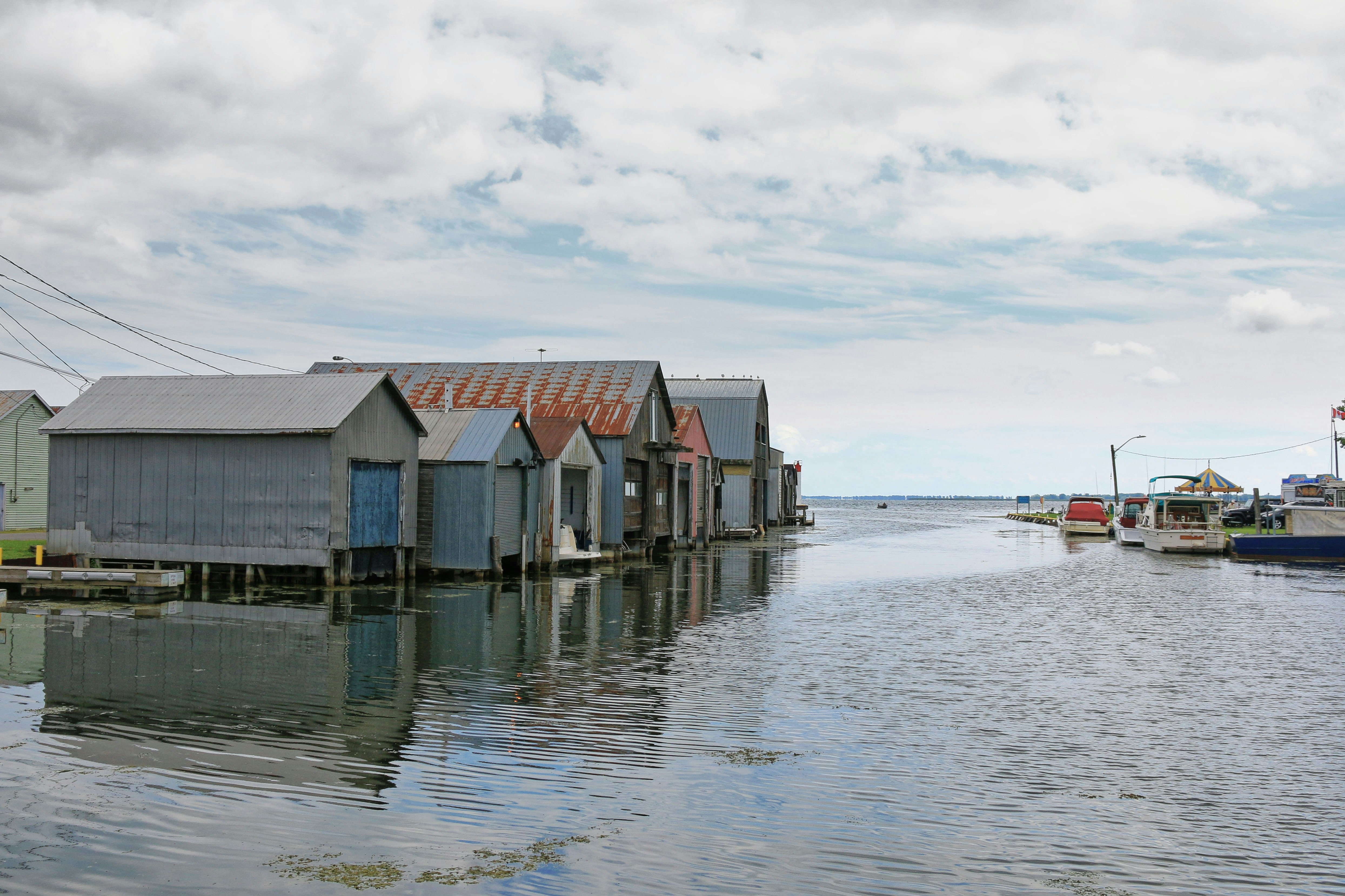 Harbor Huts and Gentle Ripples: A Quiet Waterfront Scene