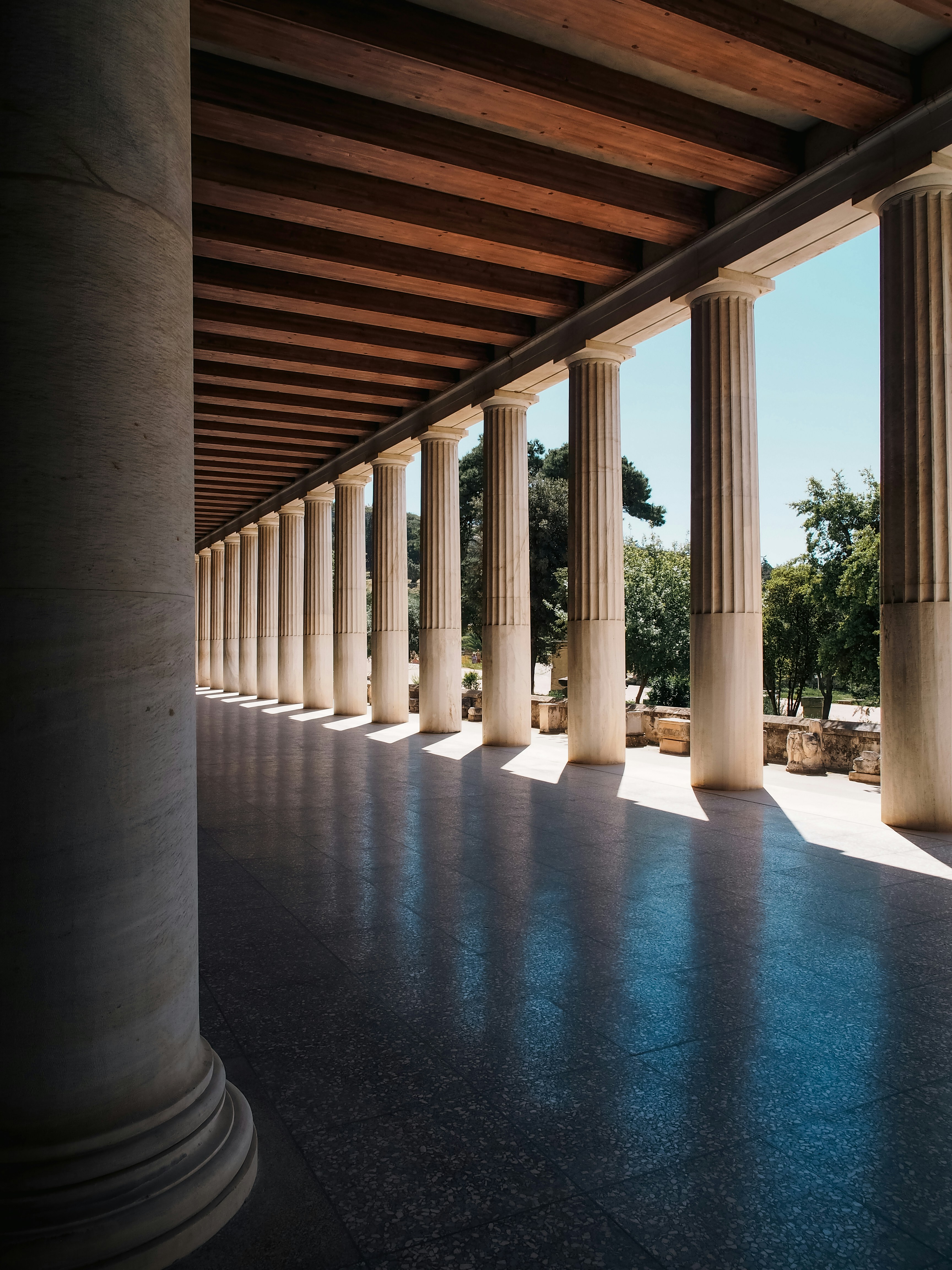 Colonnade Perspective: Light and Shadow Along the Long Corridor