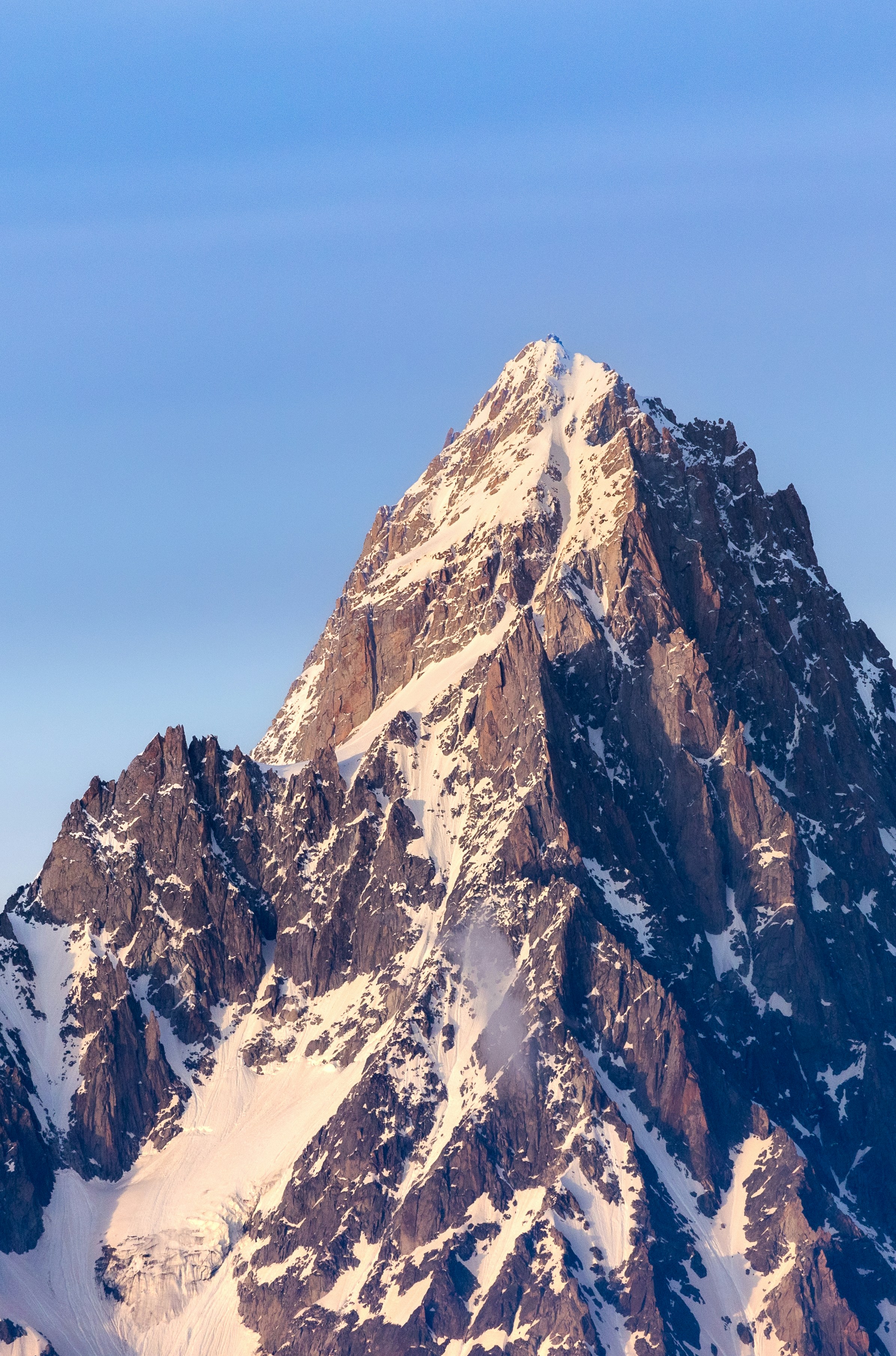Ice-Staff Summit: A Lone Peak Rising in Pale Night Light