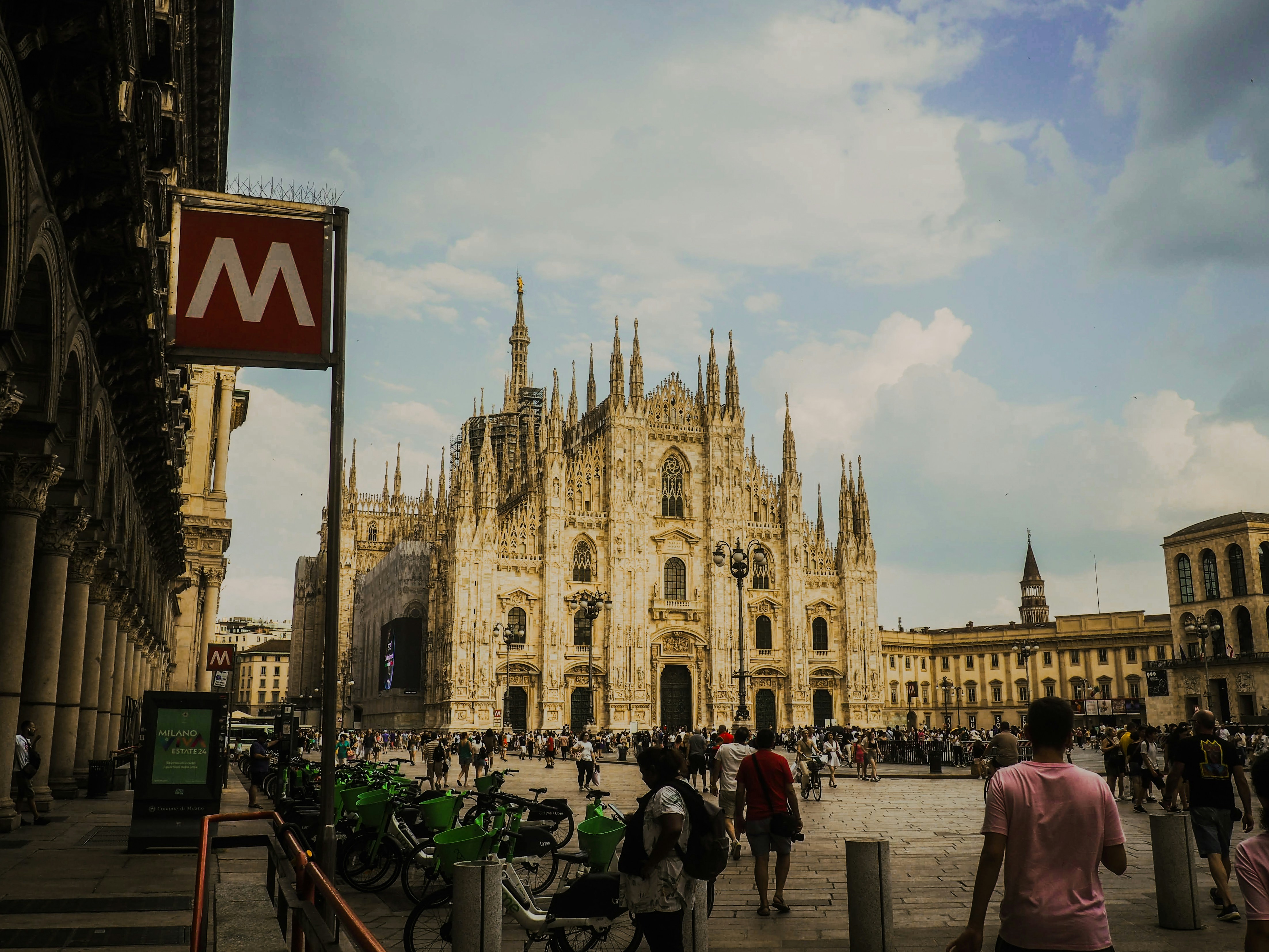 Gothic Grandeur: Milan’s Duomo Courtyard Amid City Footfall