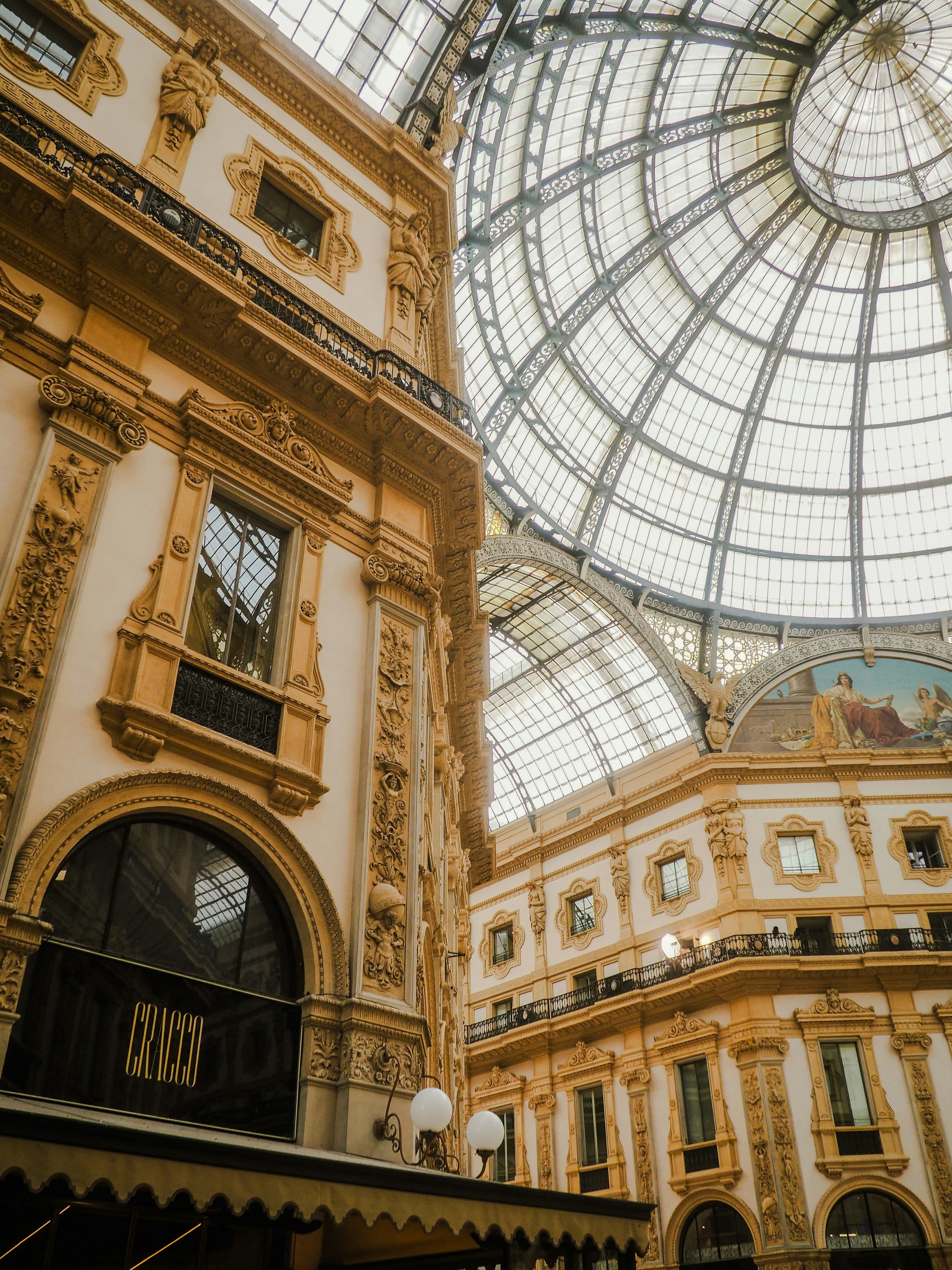 Ornate Glass Ceiling Over a Golden Facade