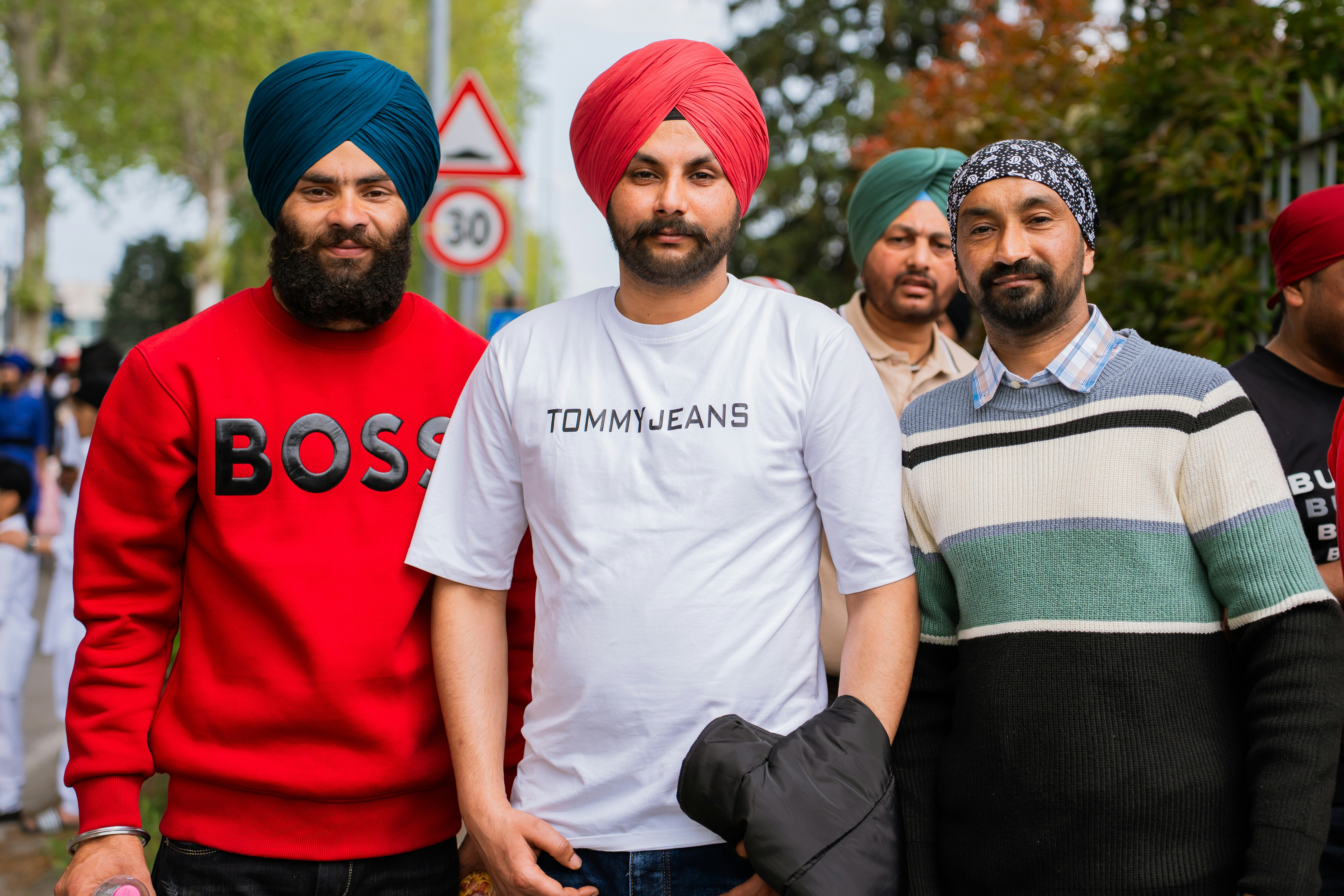 Center of Crew: A Trio of Turbaned Style Across a Busy Street