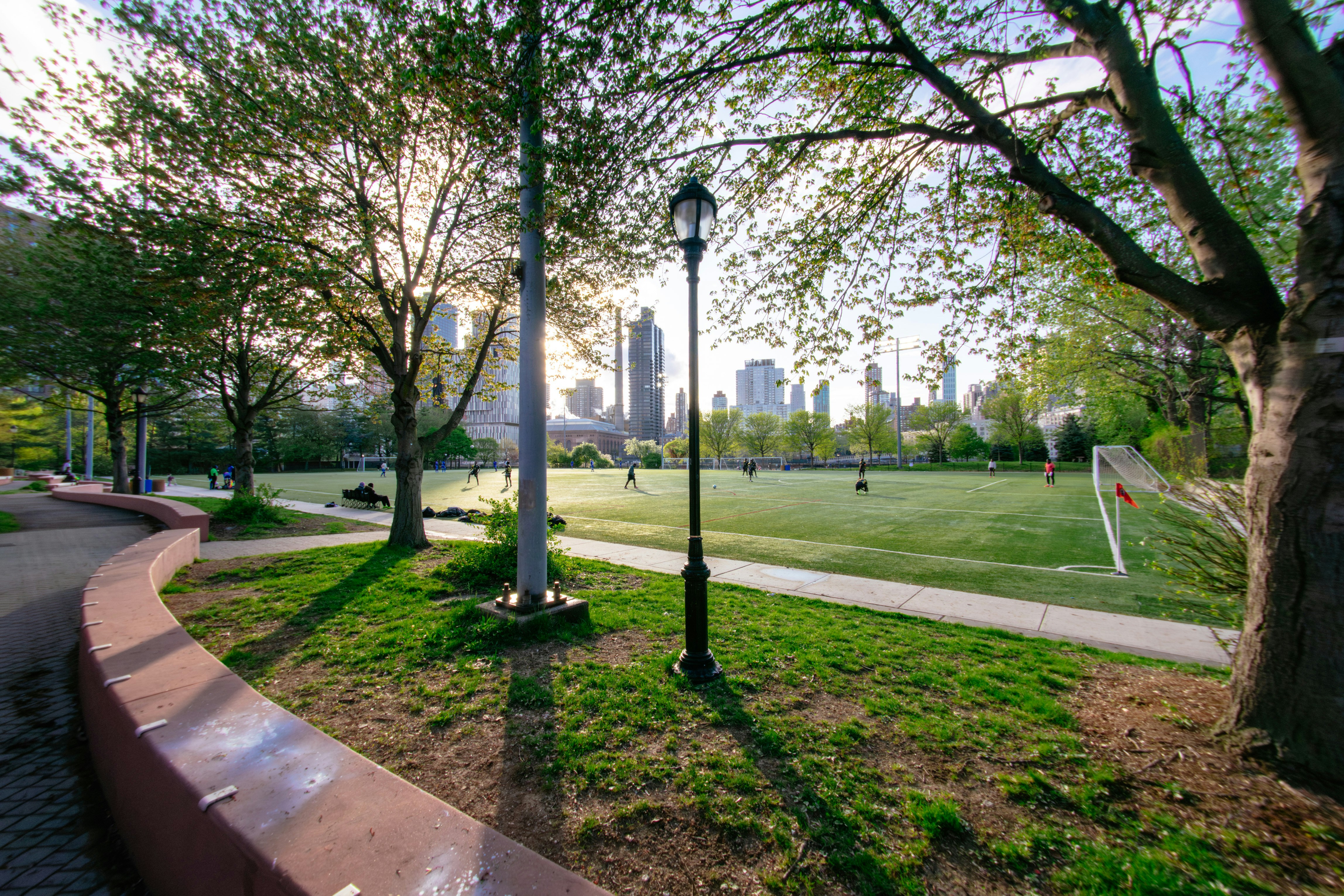 Evening Park in the City: A Lantern-lit Lawn Perspective