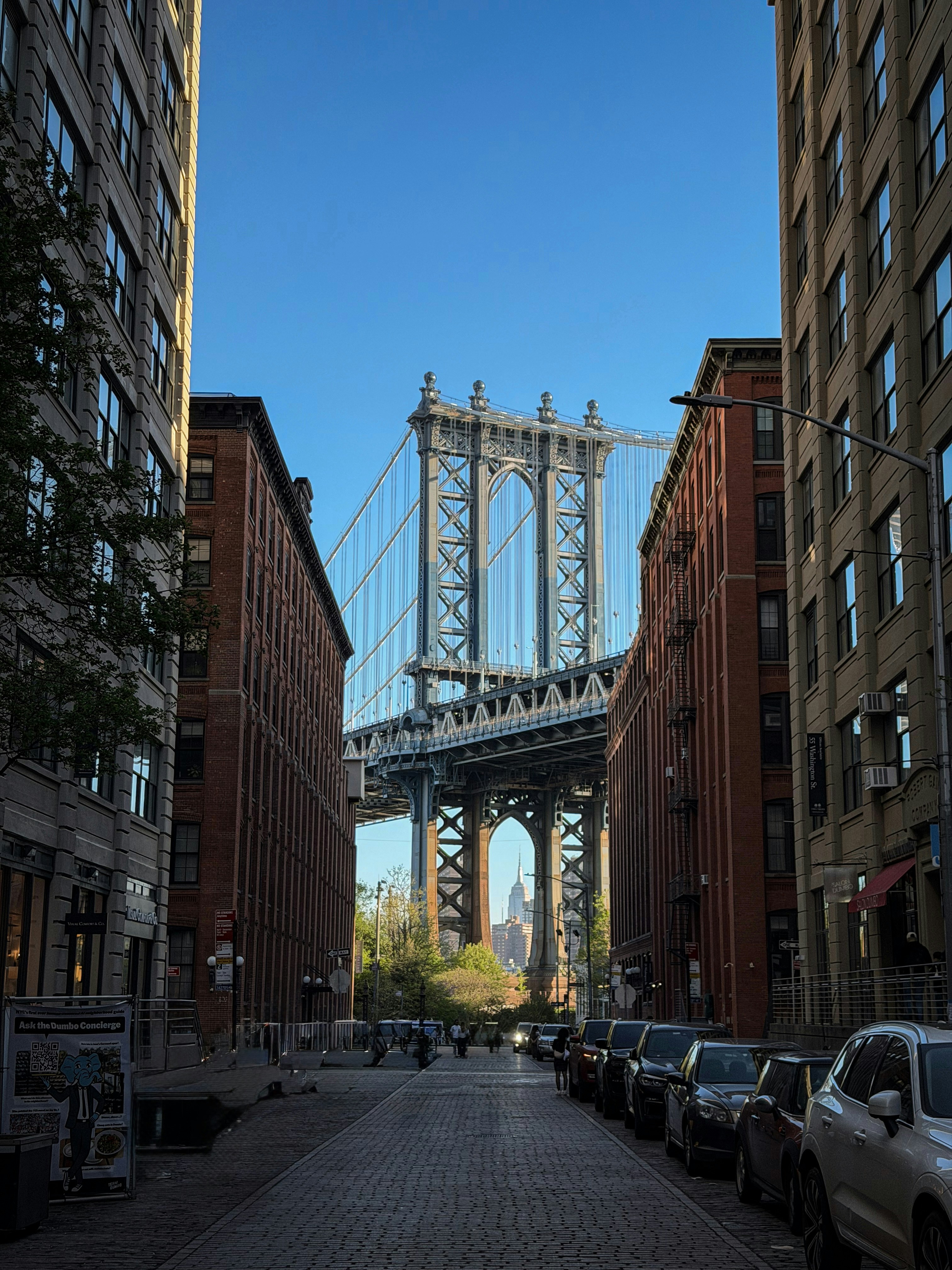 Steel Arches: A City Street Framing the Manhattan Bridge