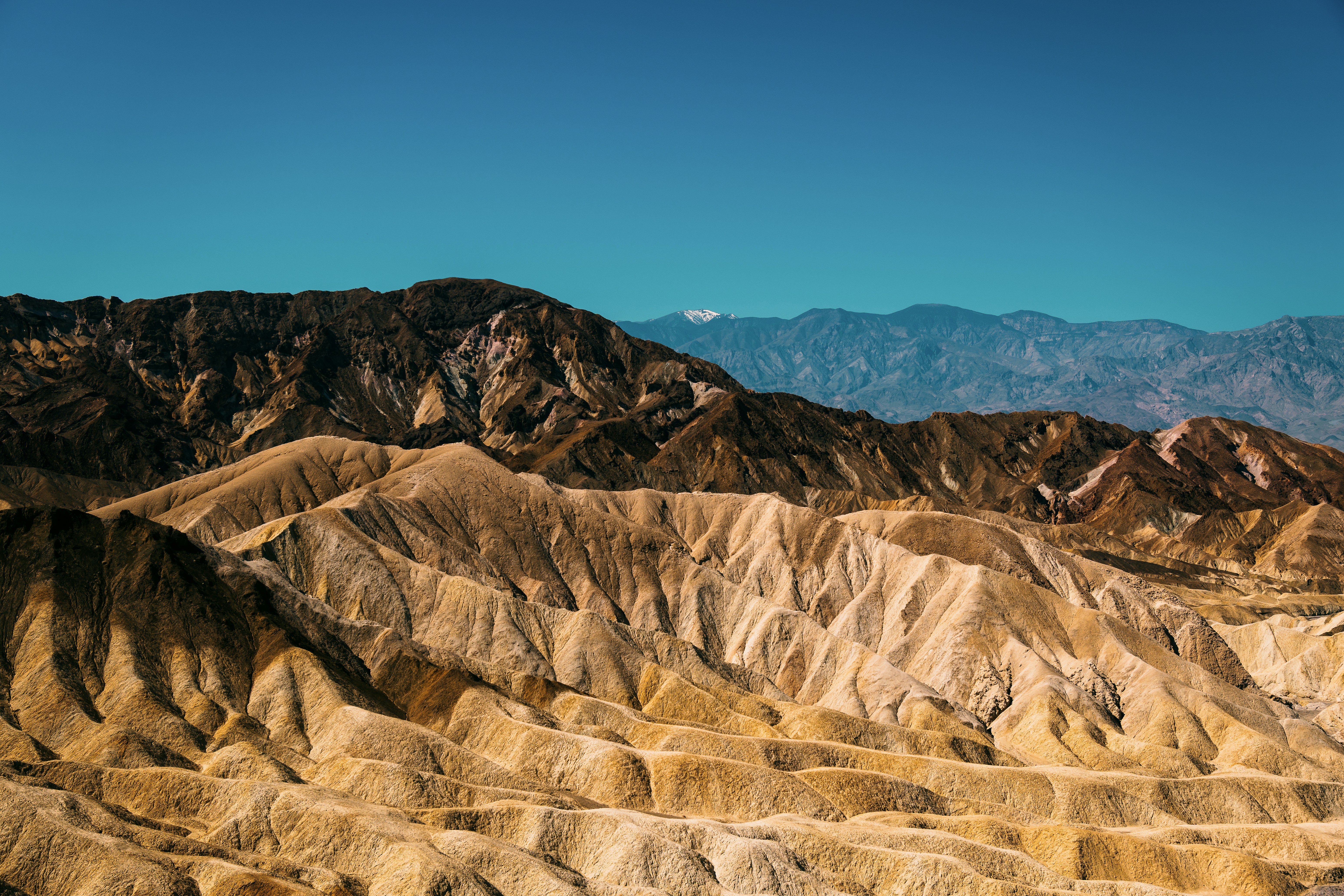 Desert Ridge Lines Under A Clear Blue Sky