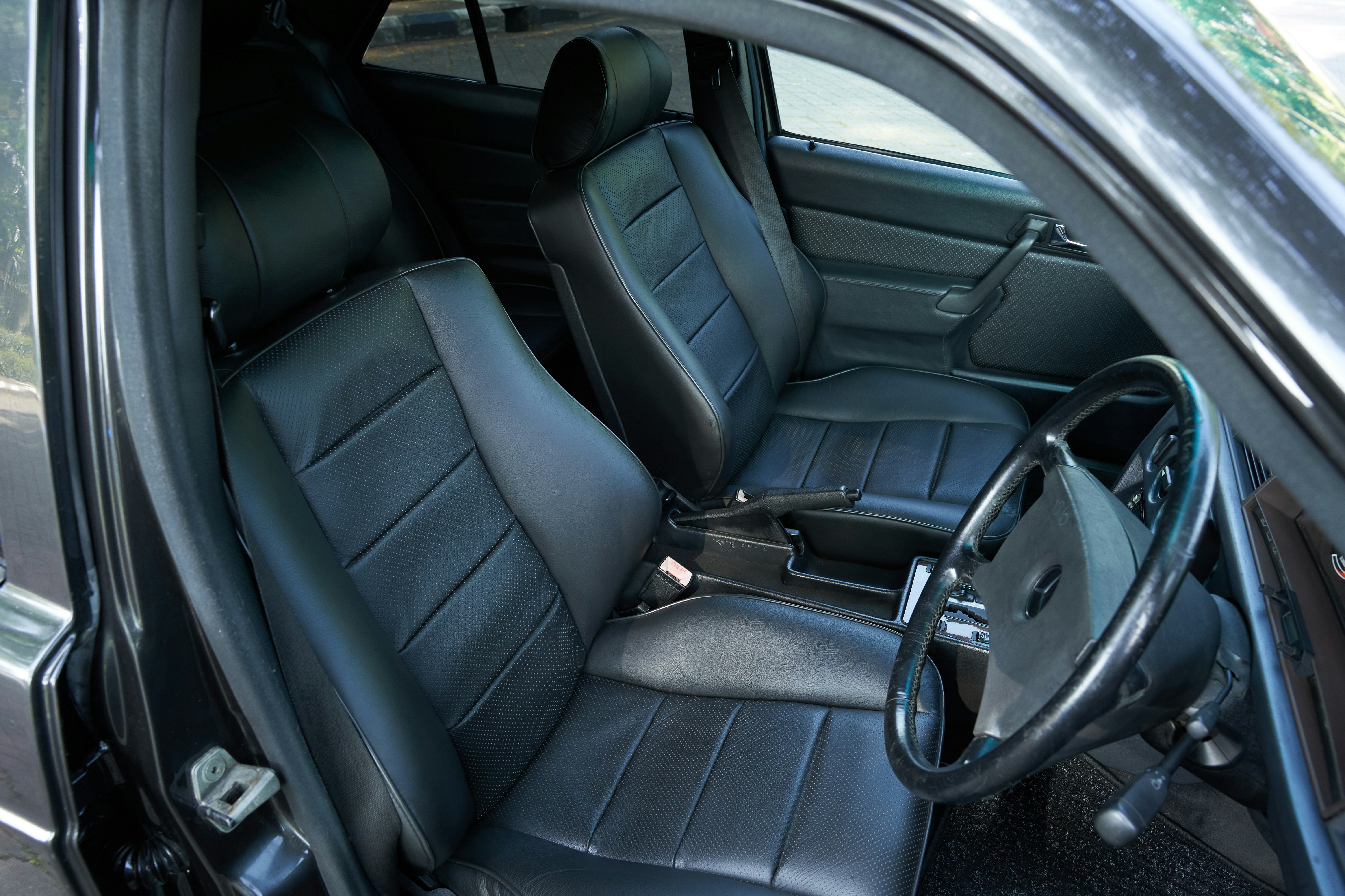 DarkLeather Car Interior: Driver's Seat and Steering Wheel in Focus