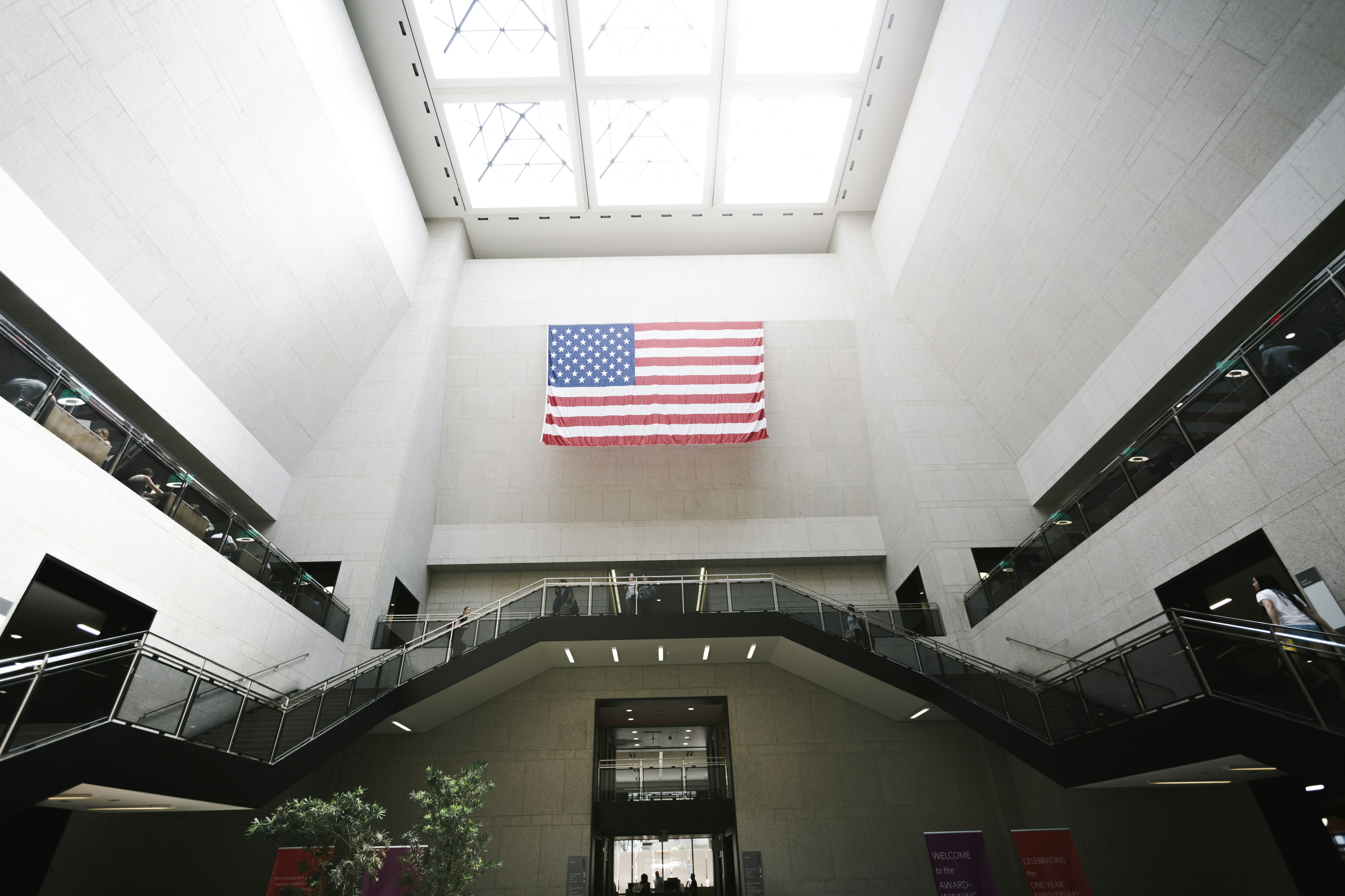 Flag over the Atrium: Ascending Lines to a Sky Lighted Dome