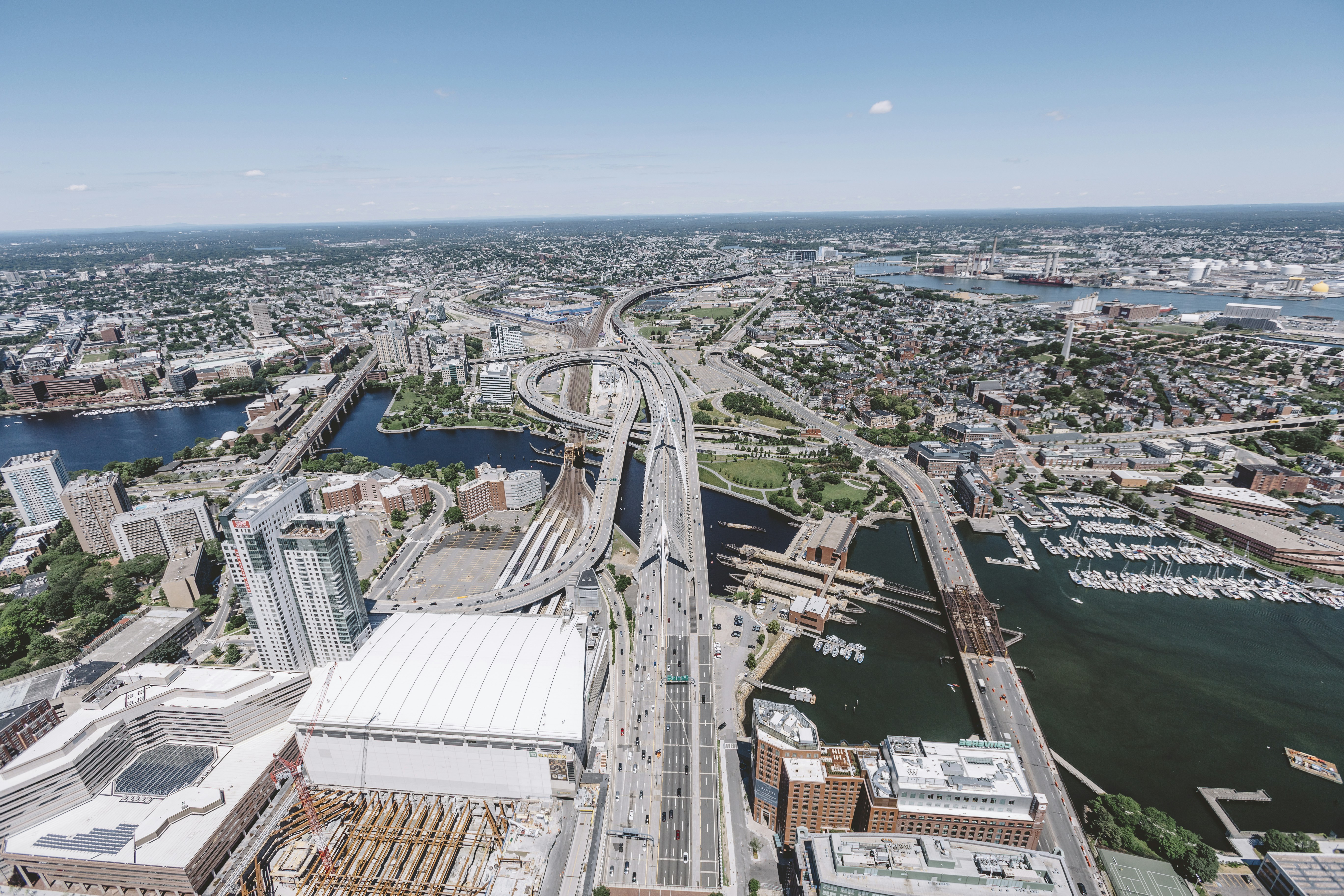 Crossing Waters: Aerial Convergence Over a City Fringe