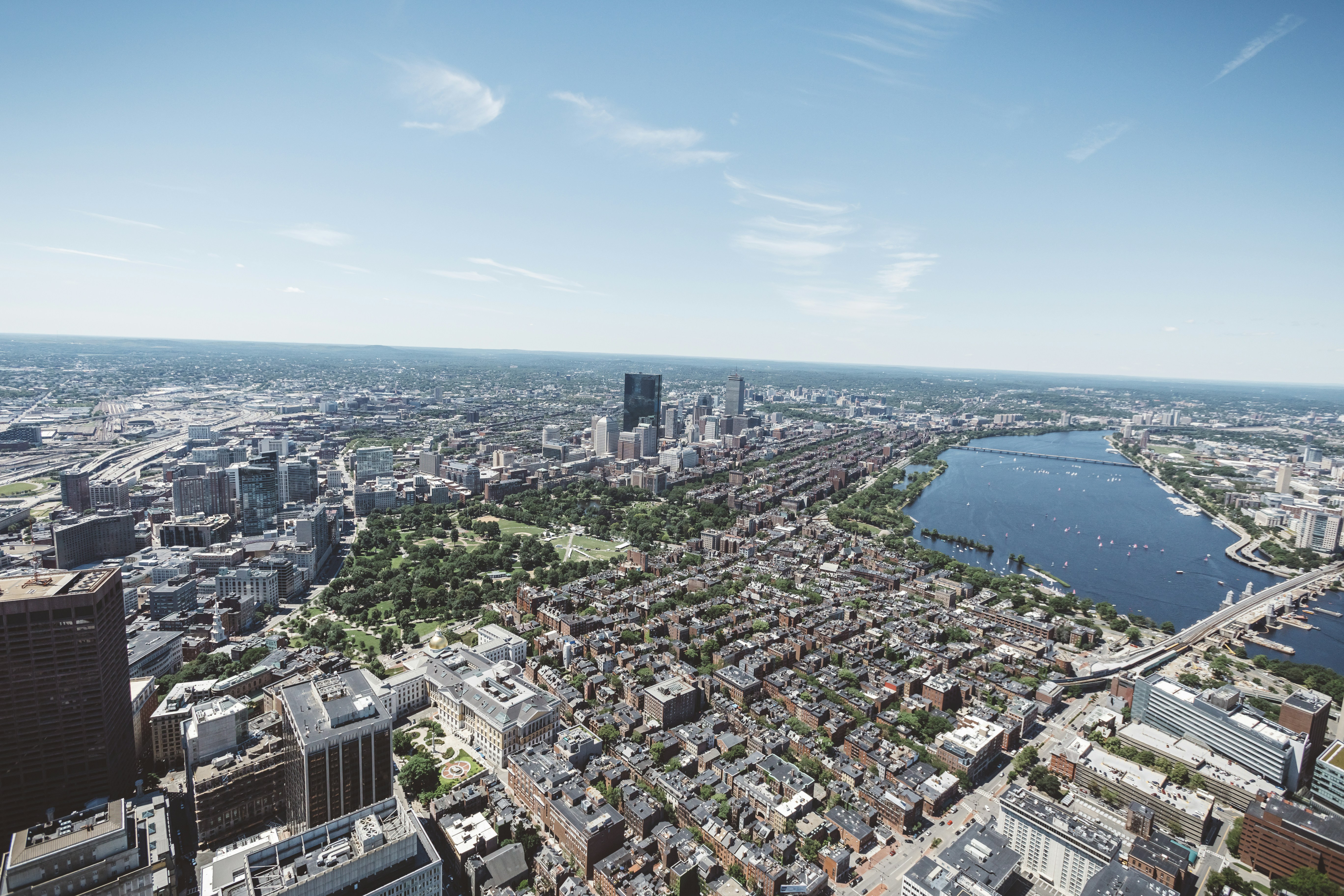 Aerial Vista Over a Lake-Side City Grid at Midday
