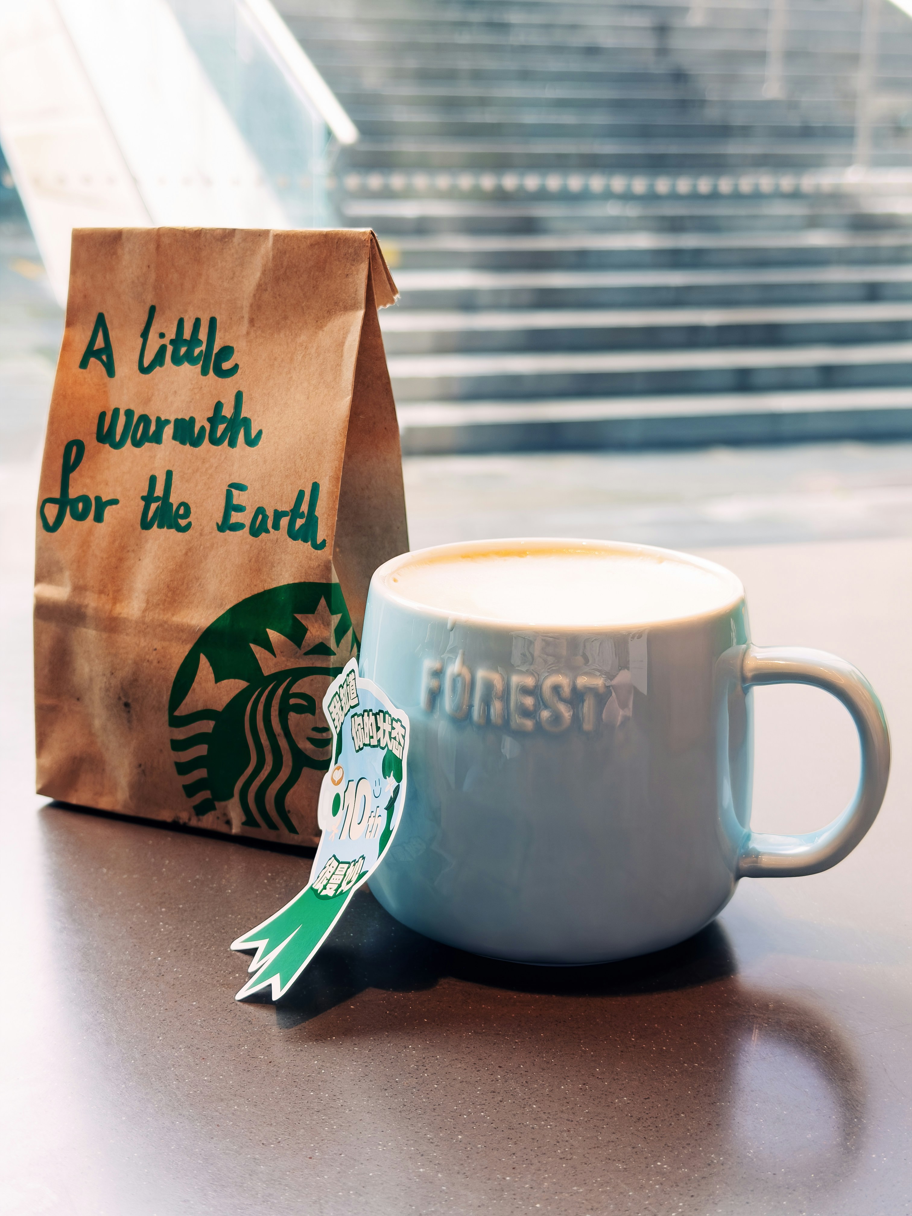 Cozy Brew Moment: Starbucks Bag and Mug on a Quiet Window Sill
