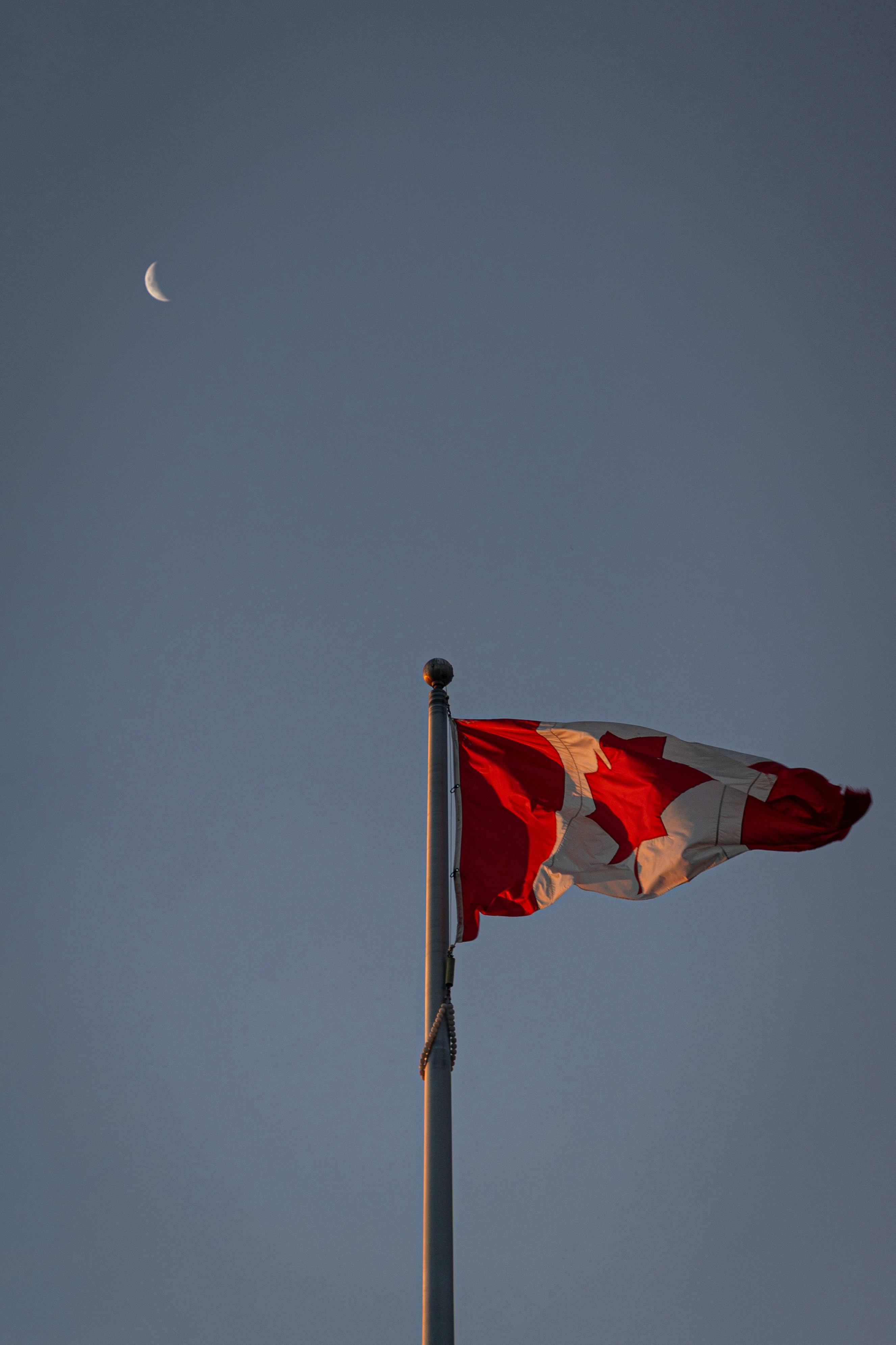 Moonlit flag over a quiet horizon
