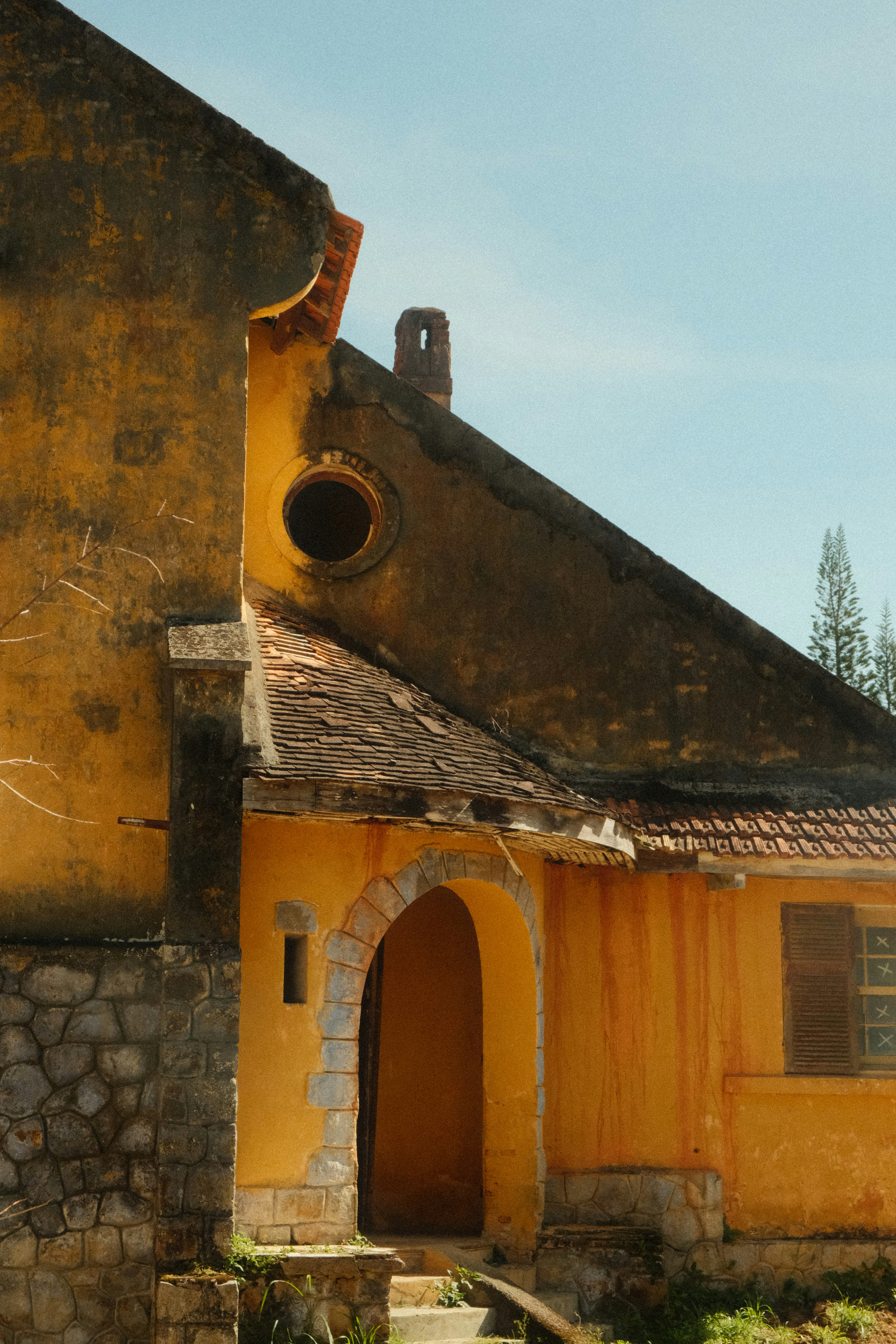 Sunlit Yellow Villa Beneath a Clear Sky