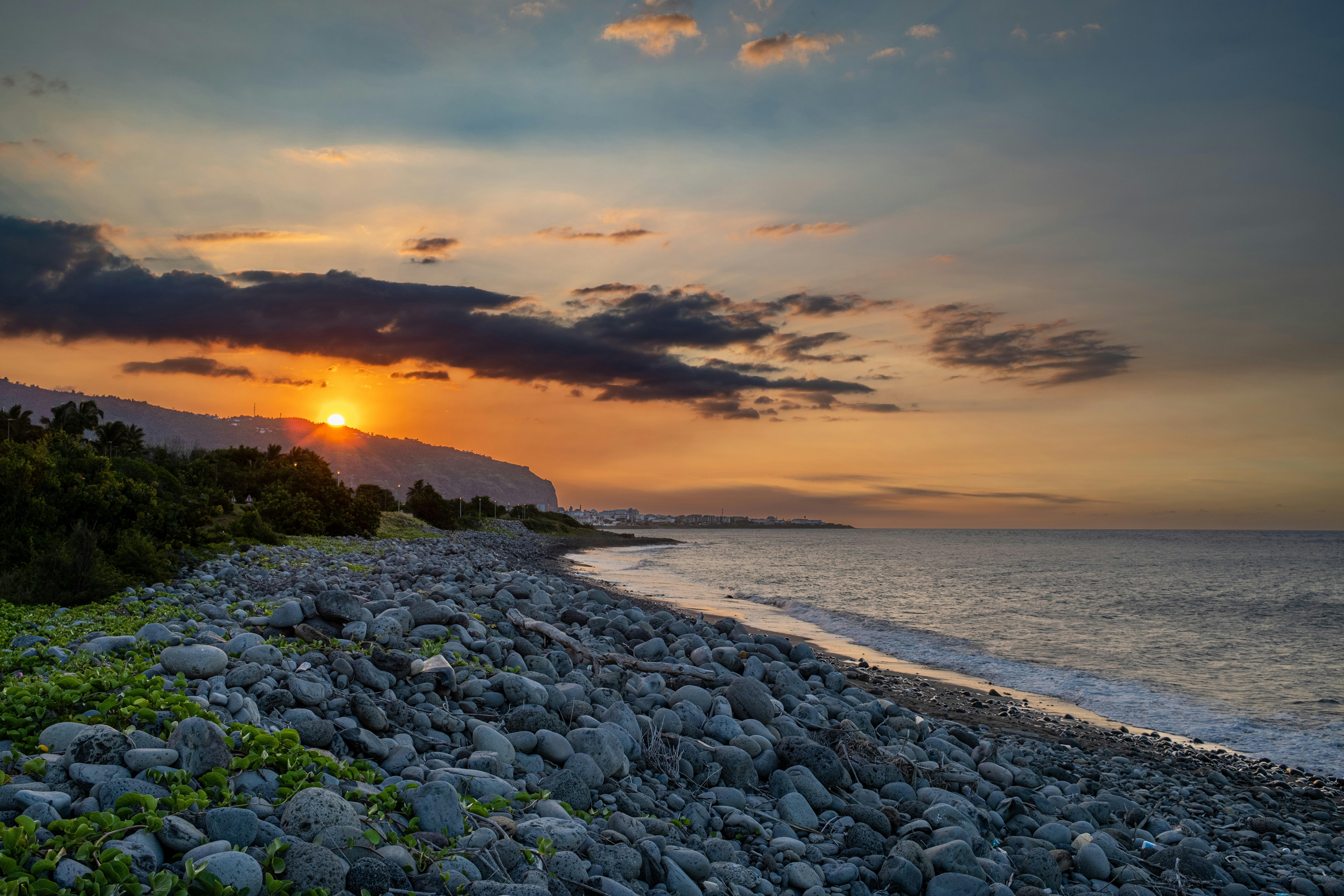 Sunset Over a Pebble Shore: Dusk on the Quiet Coast