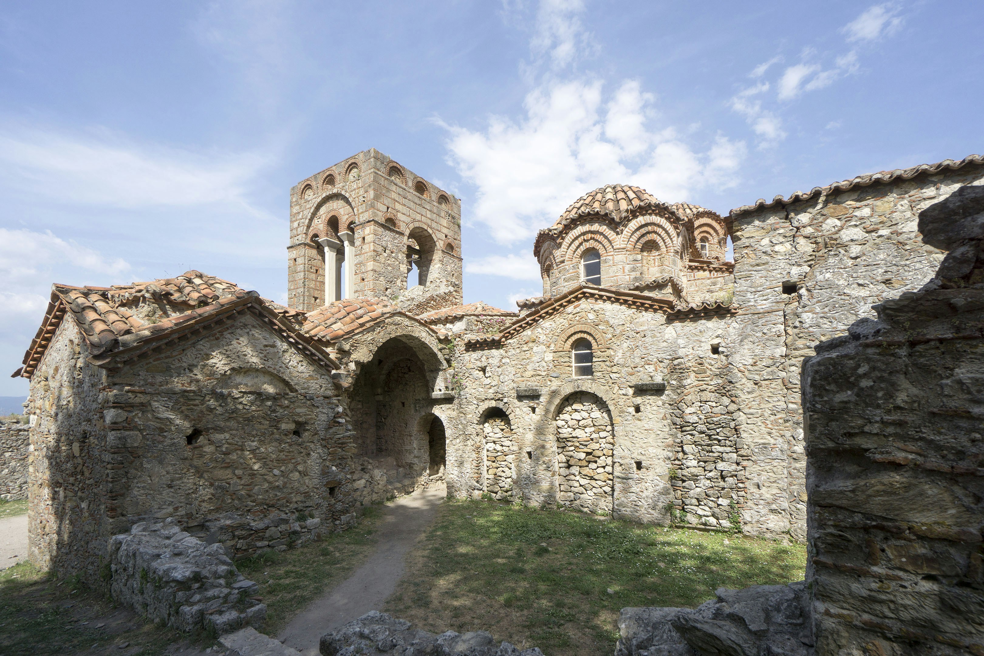 Ruined Byzantine Courtyard: Arches, Dome Fragments, and Sunlit Stones