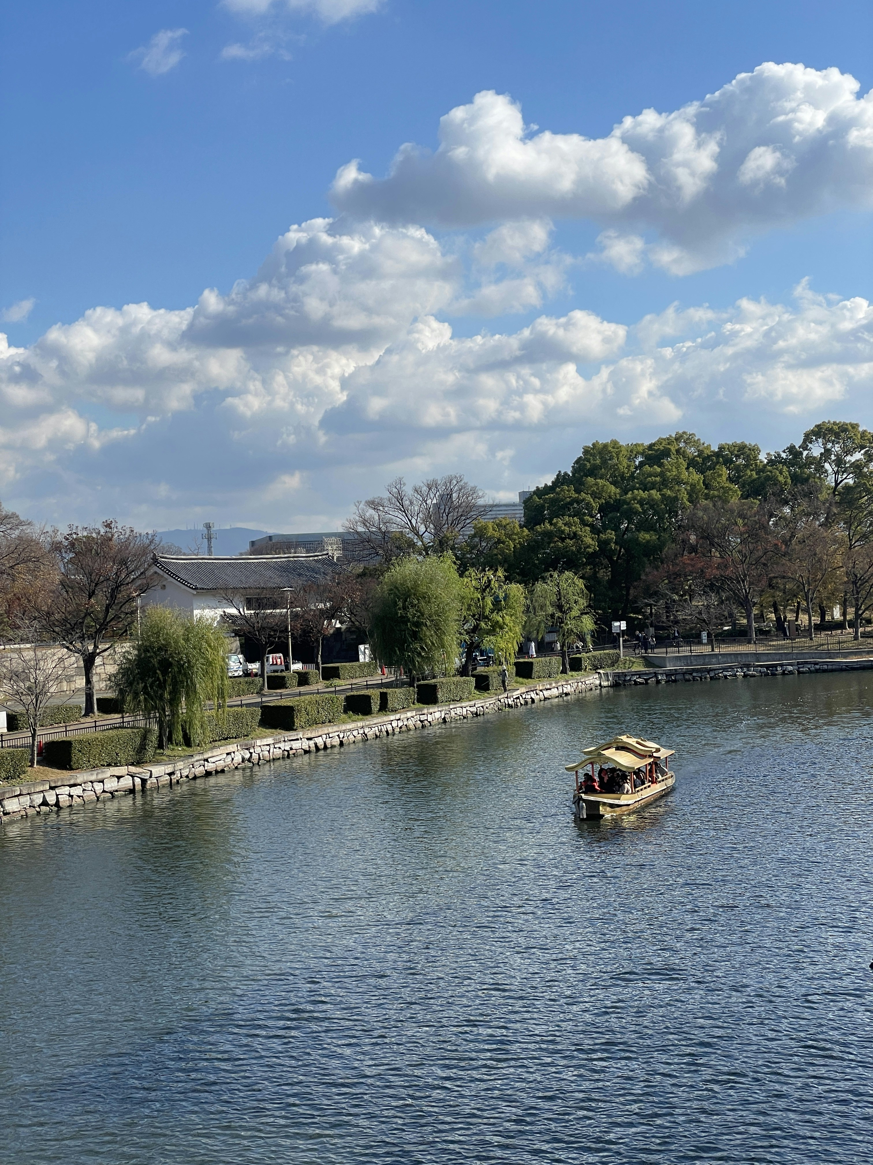 Boat Gliding Along a Tranquil City Canal