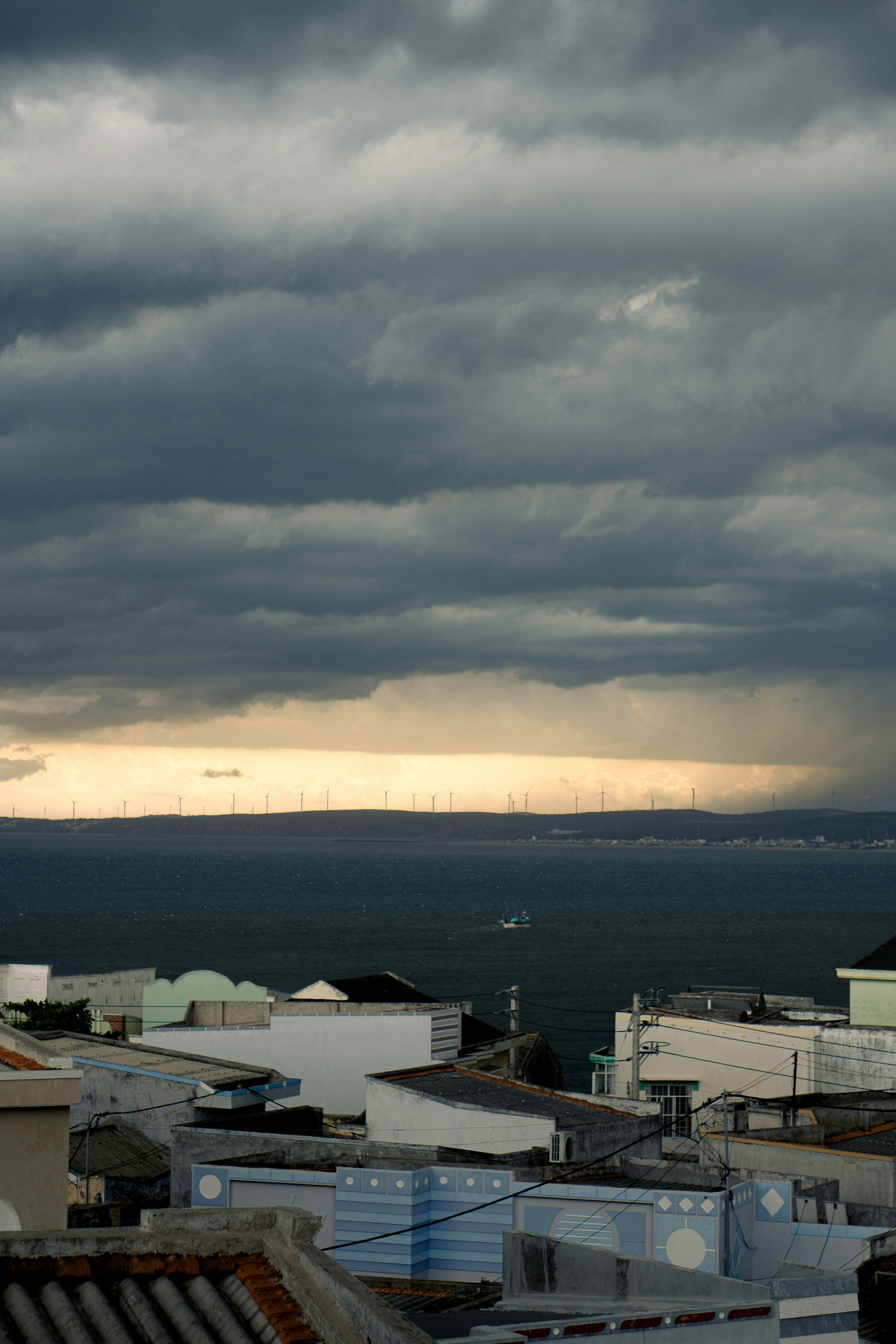 Storm Over the Harbor: Clouds Rolling Toward a Quiet Shore