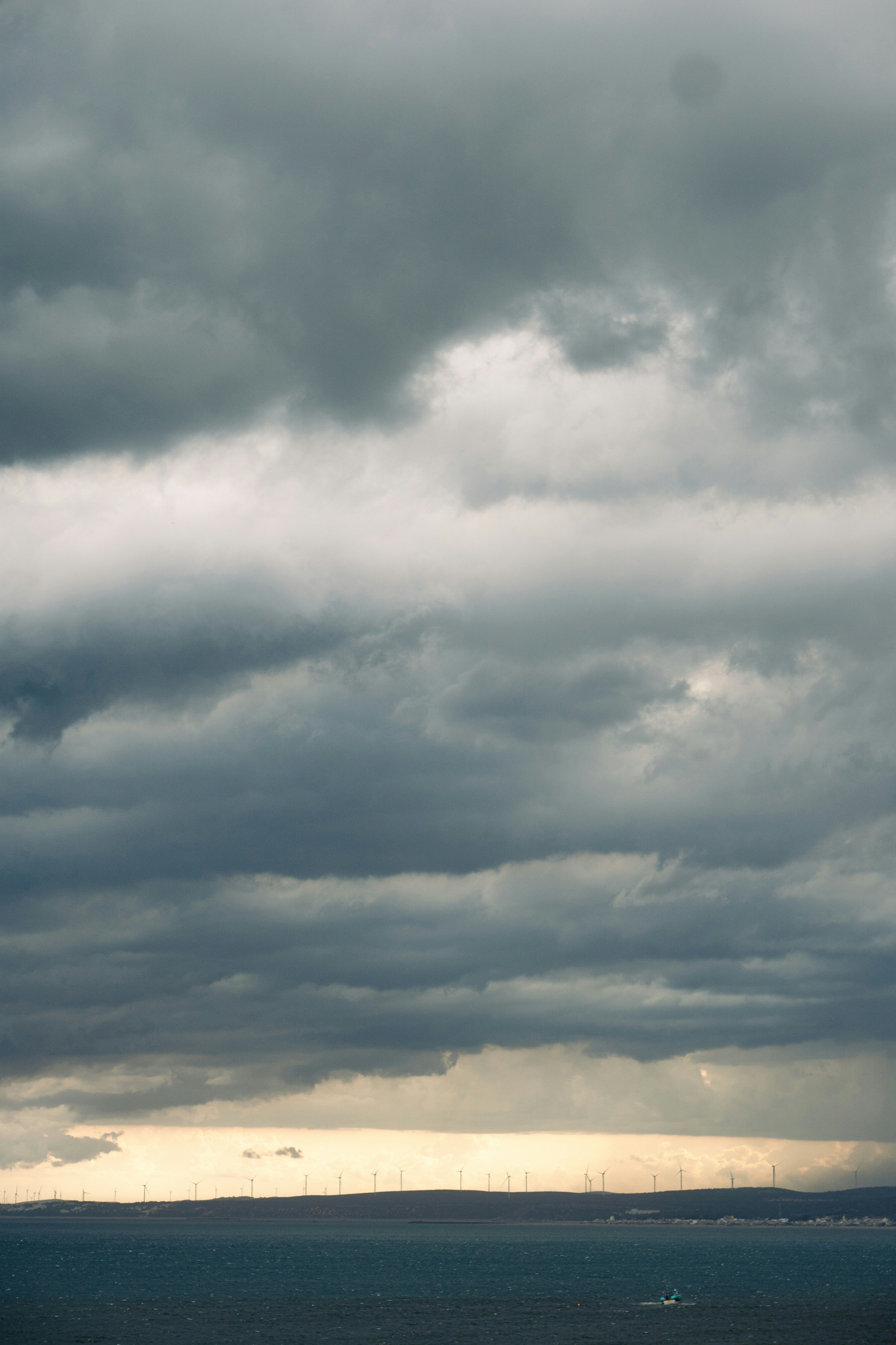 Low–Horizon Stormscape Over Quiet Waters