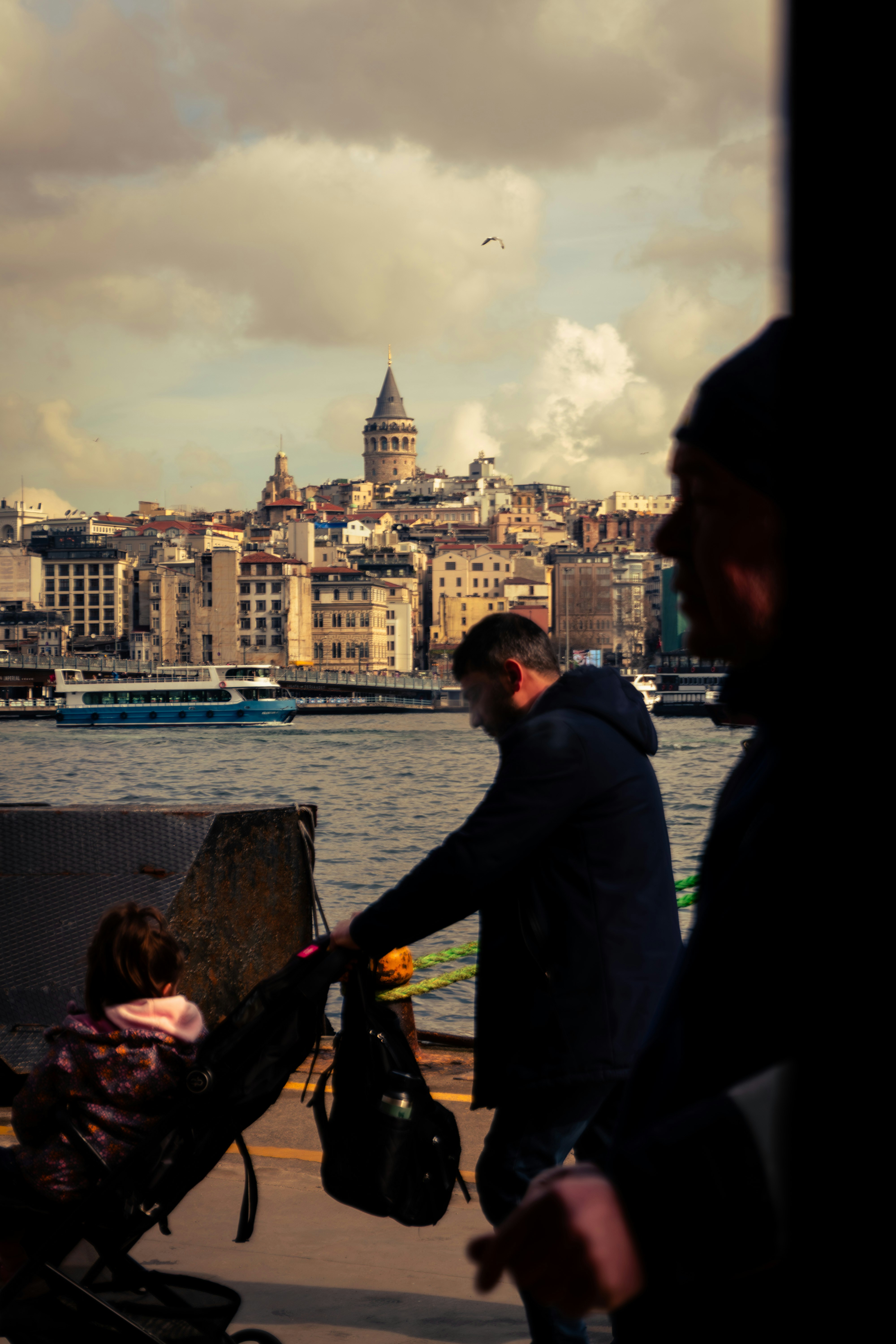 Toward the Waterfront: A Father and Child Amid Istanbul’s Silhouette