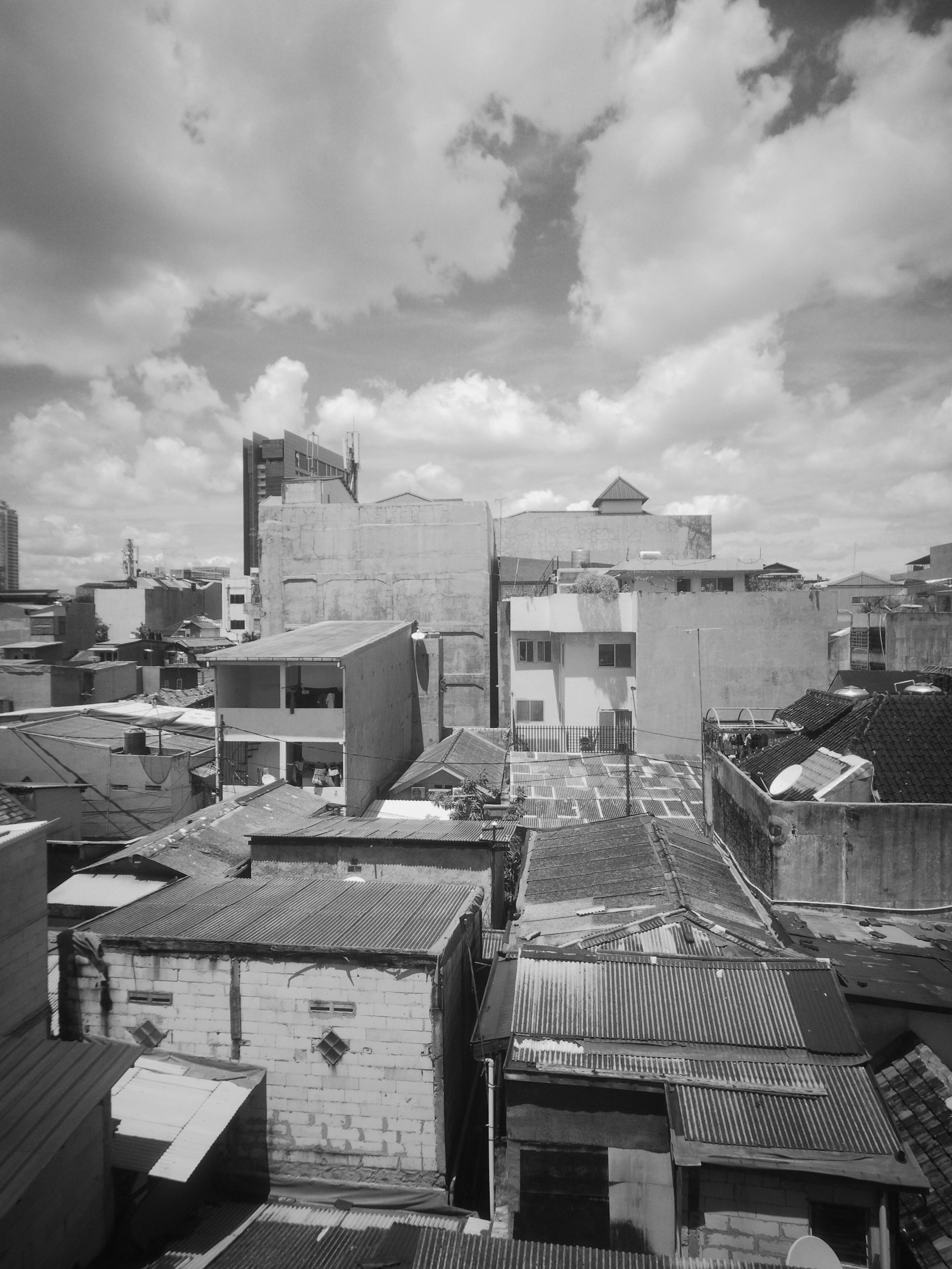 Urban Rooftops Under a Break in the Clouds