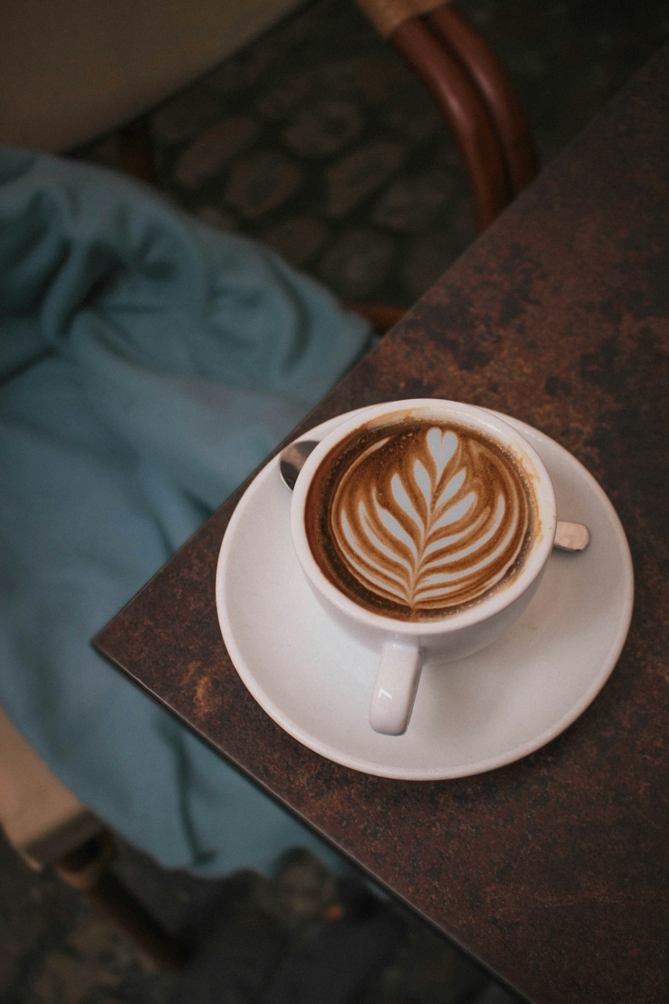 Latte Art Rendezvous on a Rustic Table