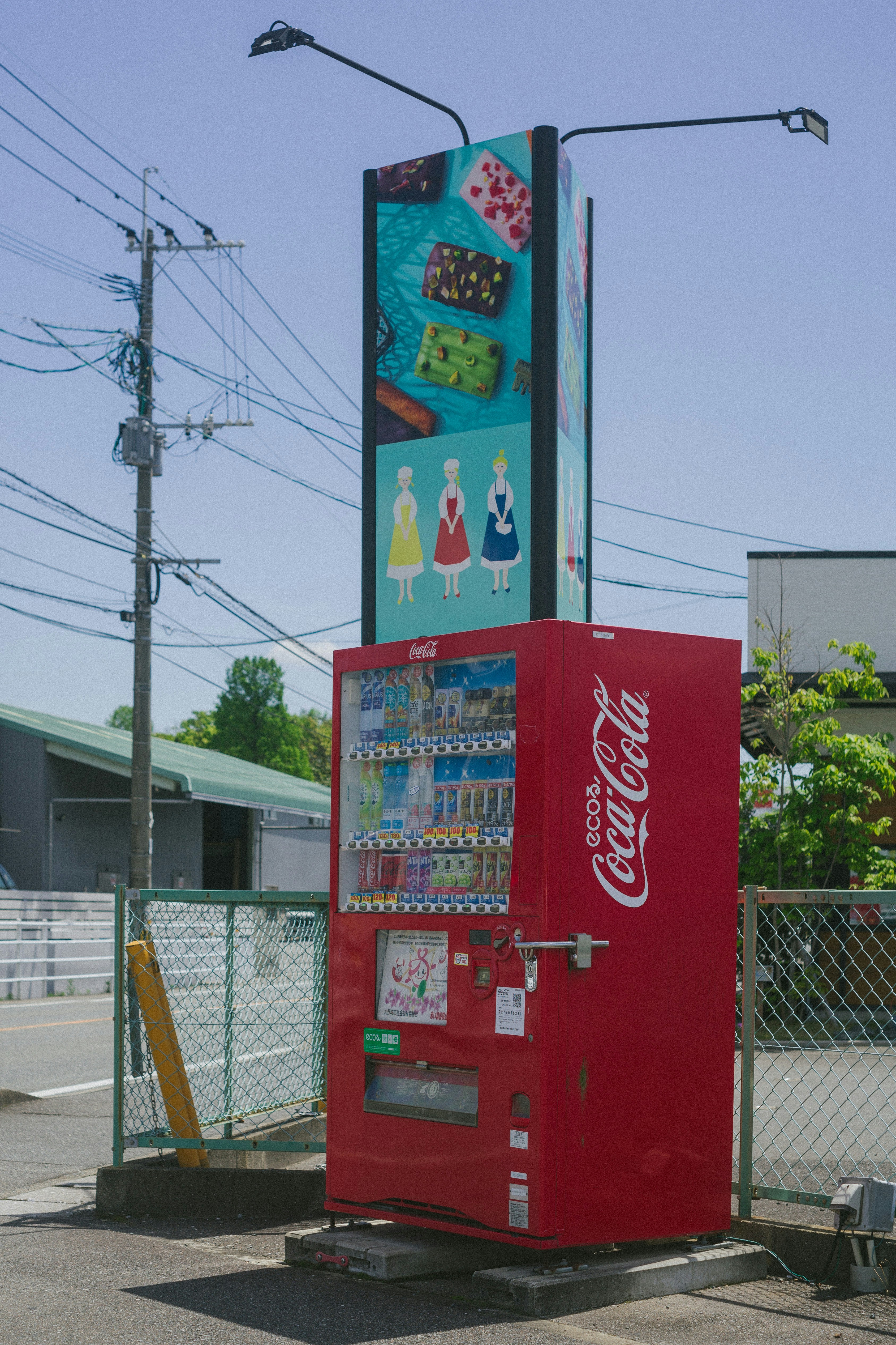 Red Vending Pulse: Coca-Cola Stand Near Bright Signage