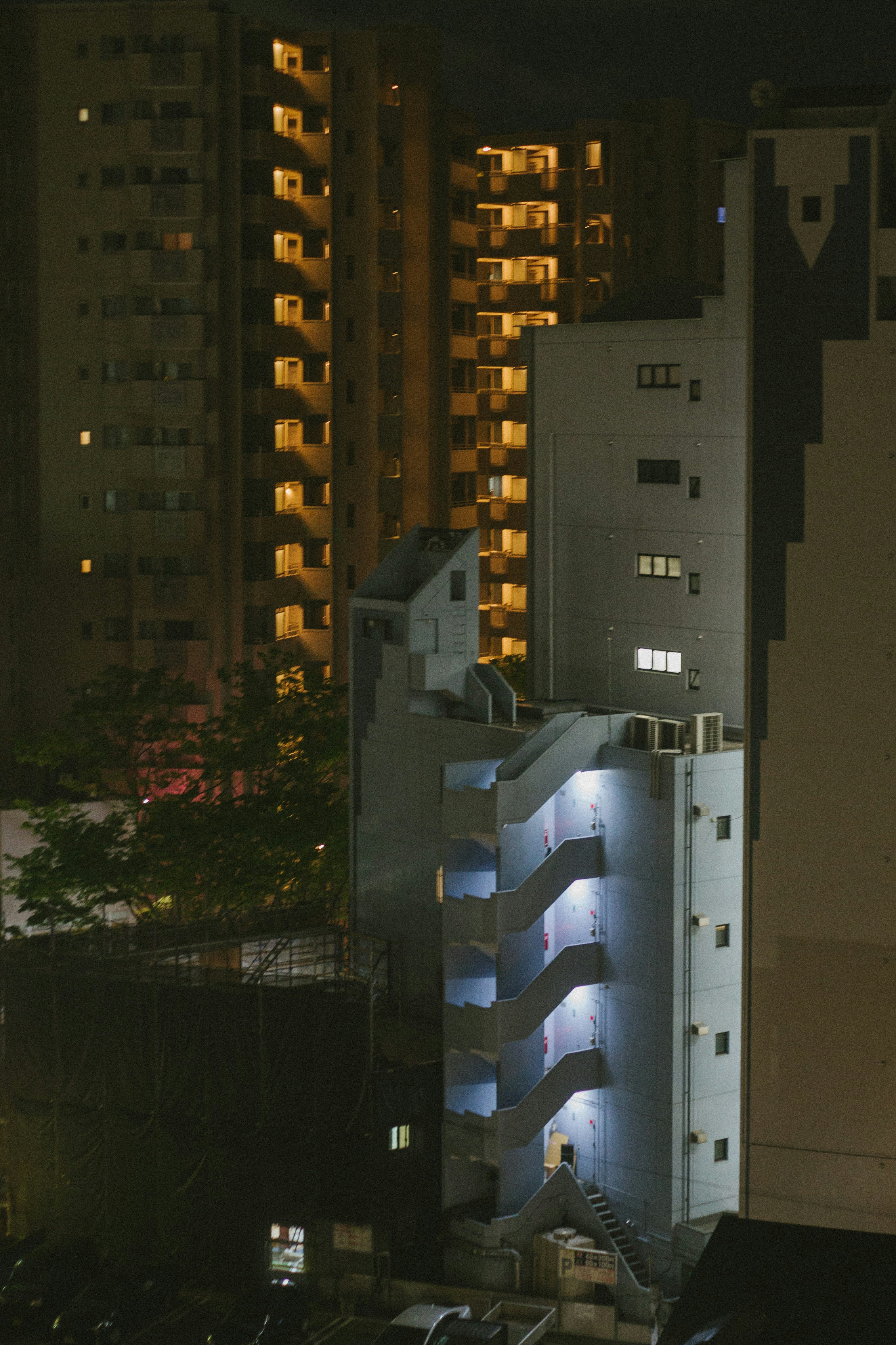 Tall Nightscape Staircase Illuminated by Neon Blues