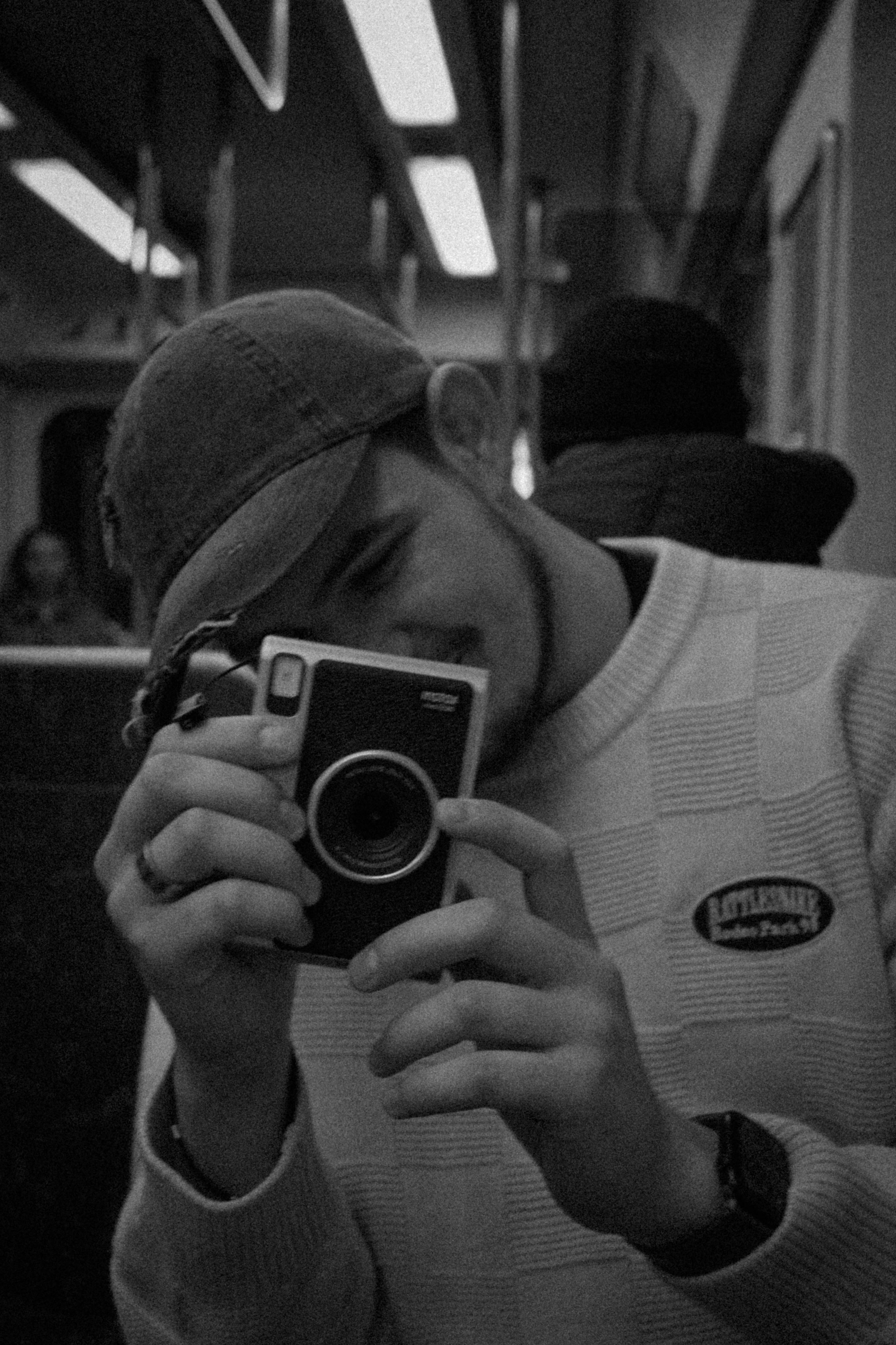 Self-portrait in a dim subway: a candid snapshot of a photographer at work