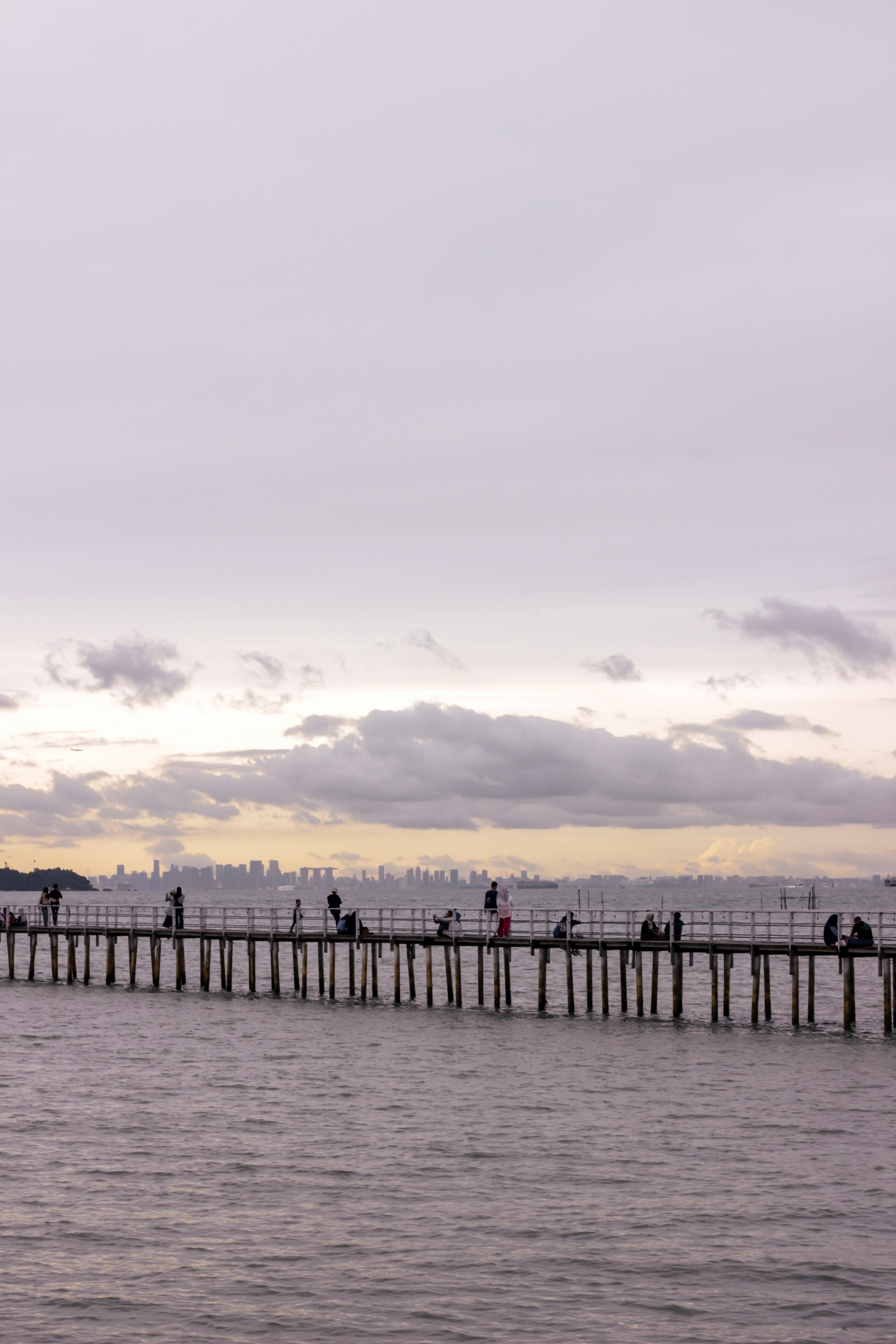 Pier of Silhouettes: A Quiet Walk Across the Horizon Line