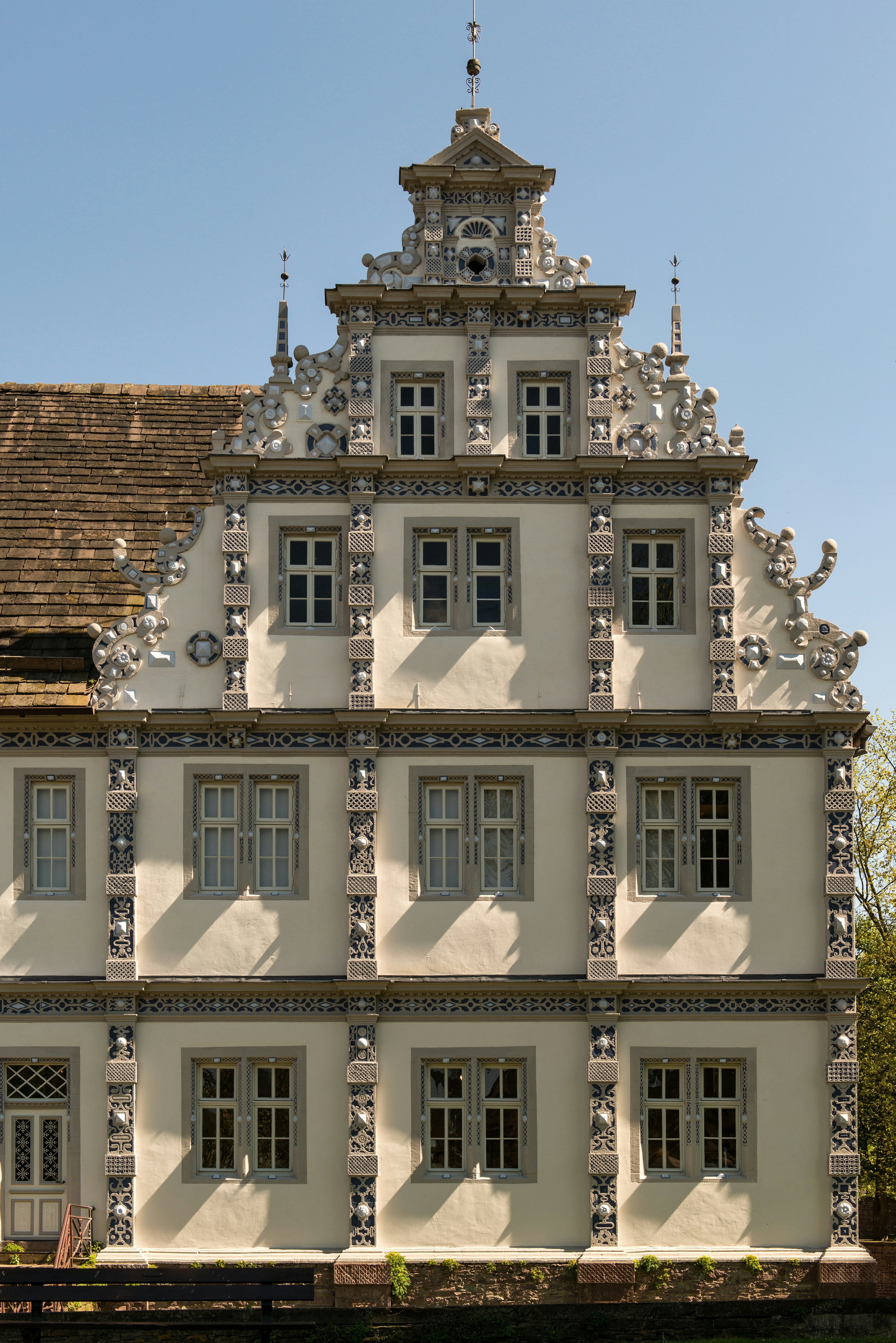 Ornate Facade Rising: Baroque Gables against a Clear Sky