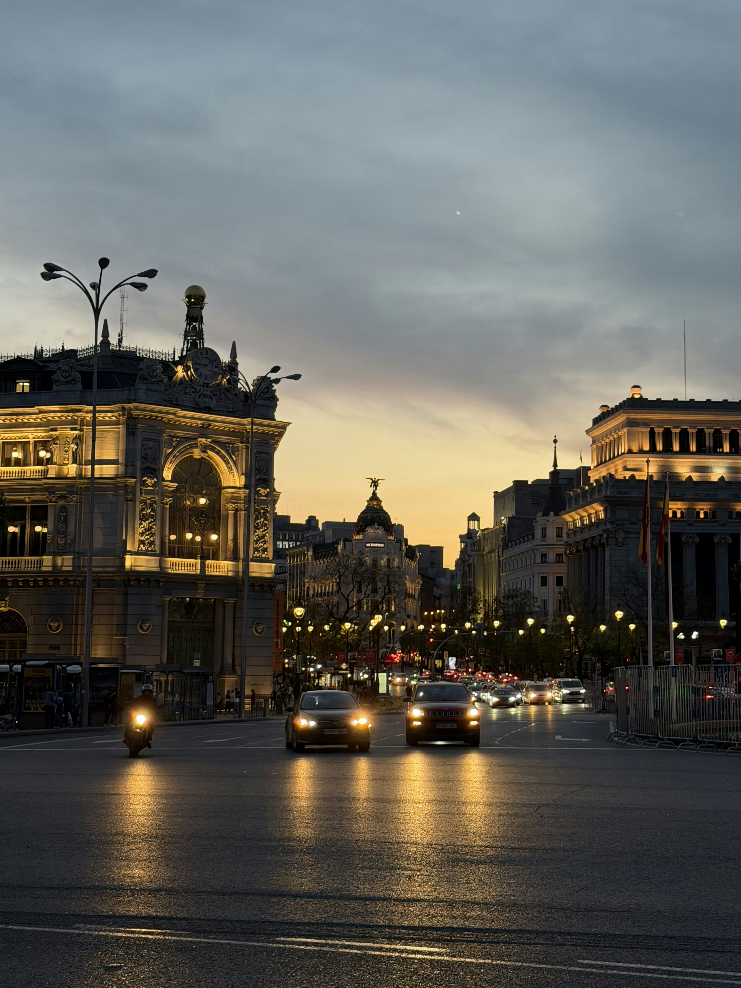 Golden Arcades at Dusk: City Street Carving Through Historic Facades