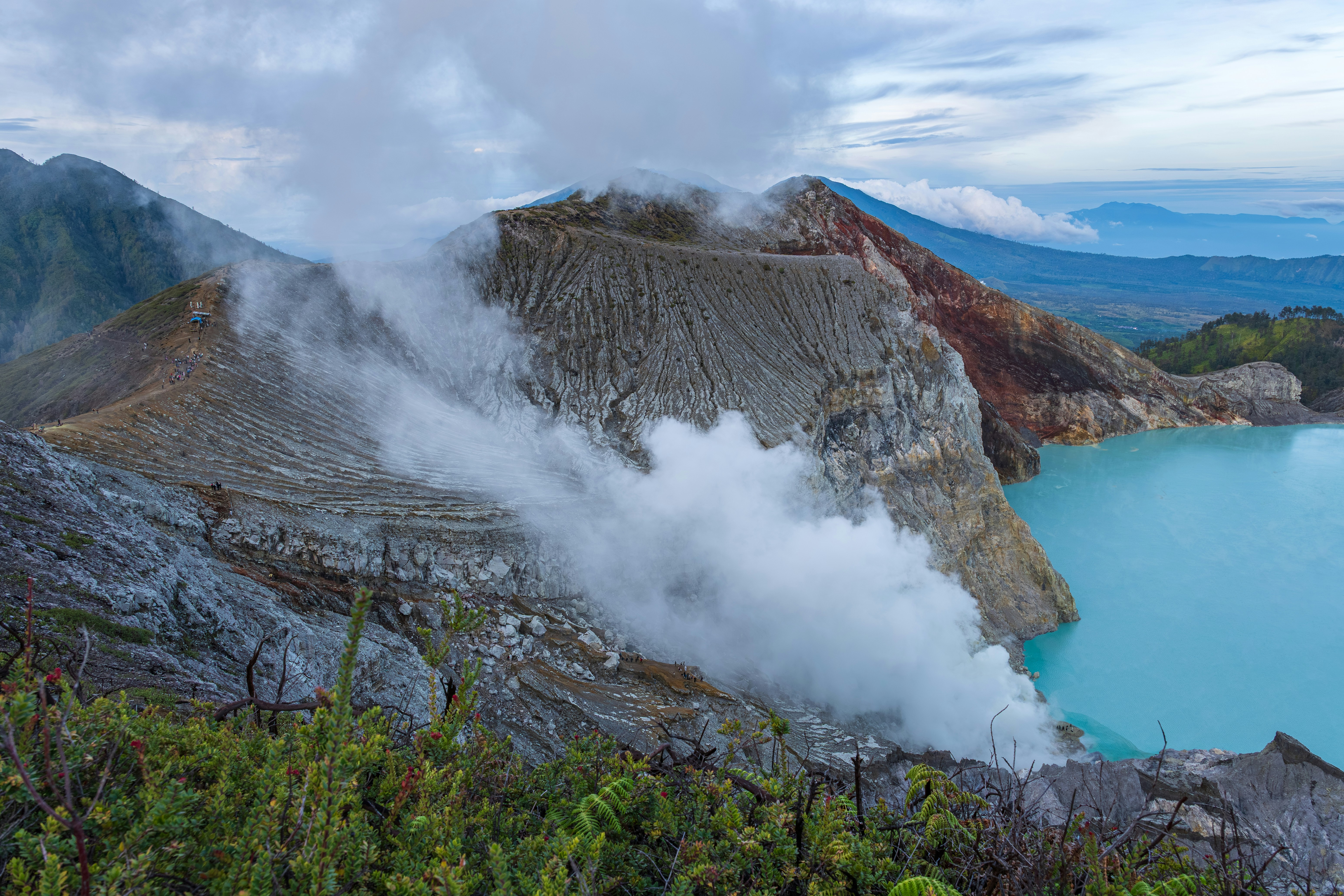 Emerald Crater and Mist: A Quiet Rim Over Turquoise Caldera